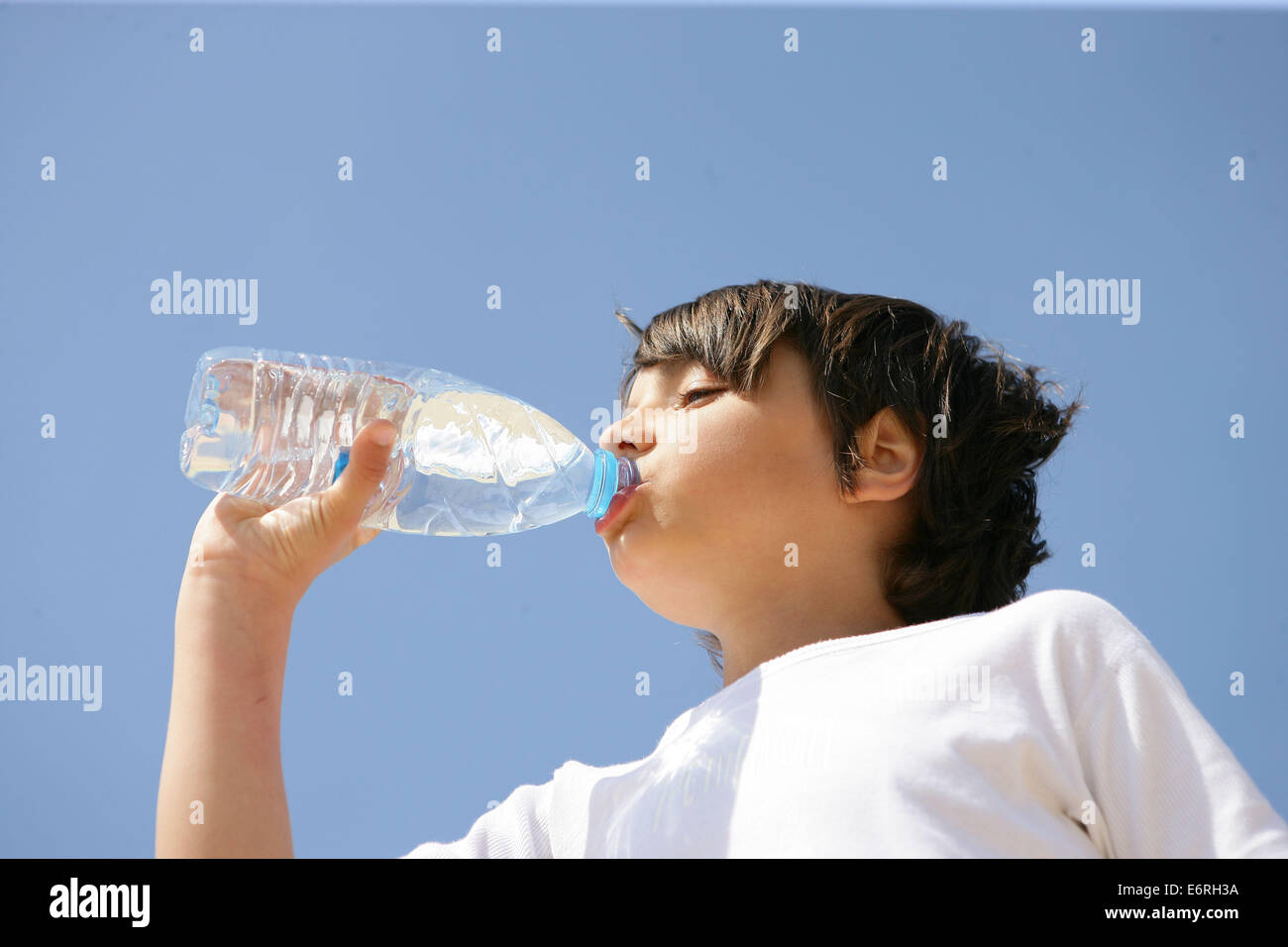 Little boy drinking Stock Photo - Alamy