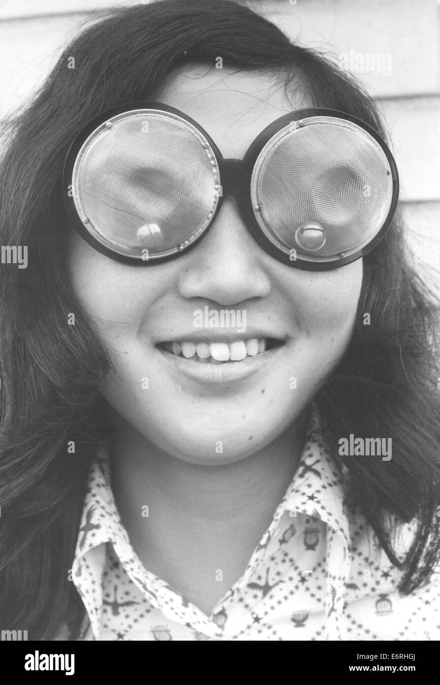 Tokyo, Japan. 20th Mar, 1970. A woman models funky glasses made of ...