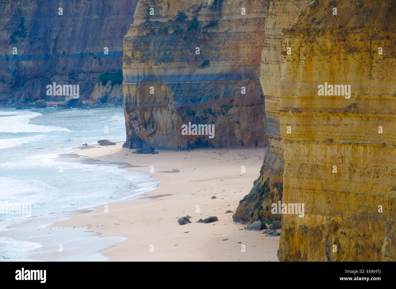 Towering rocks meet the sea along the Great Ocean Road near Melbourne ...