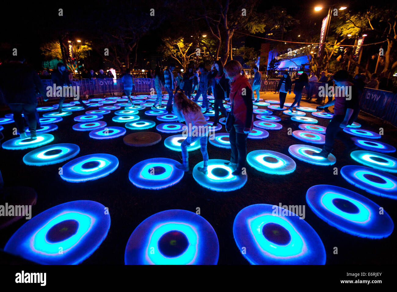 Tourists enjoy an interactive installation at the Vivid Festival, The ...