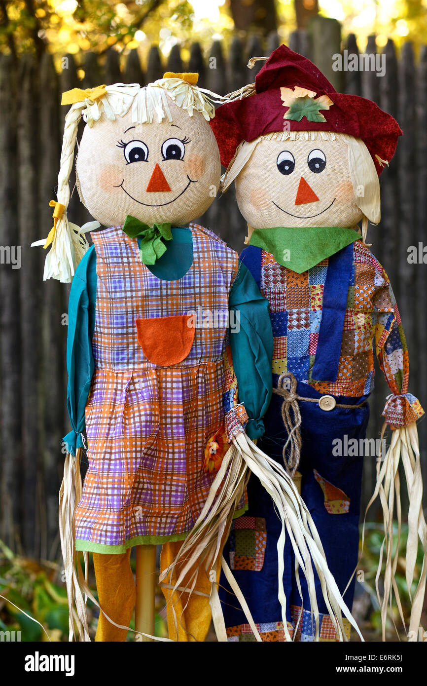 Two happy scarecrows in a garden Stock Photo - Alamy