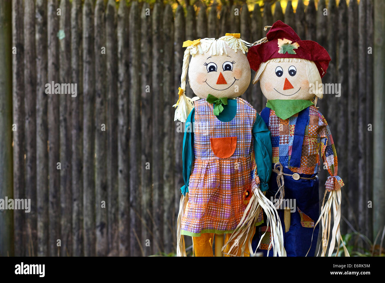 Two happy scarecrows in a garden Stock Photo - Alamy
