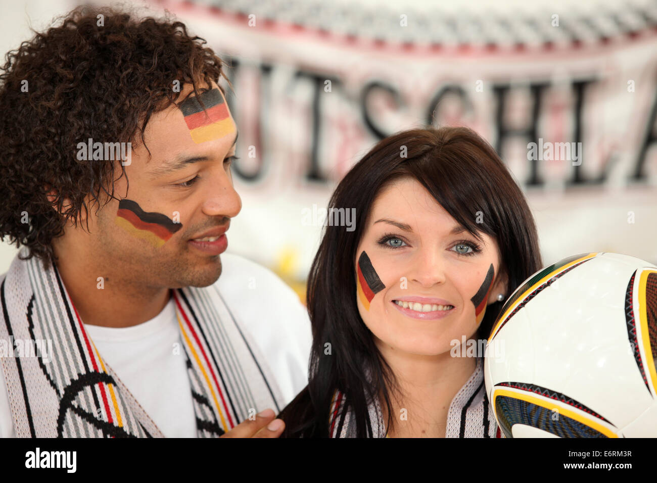 German man and woman ready to support their national team Stock Photo ...