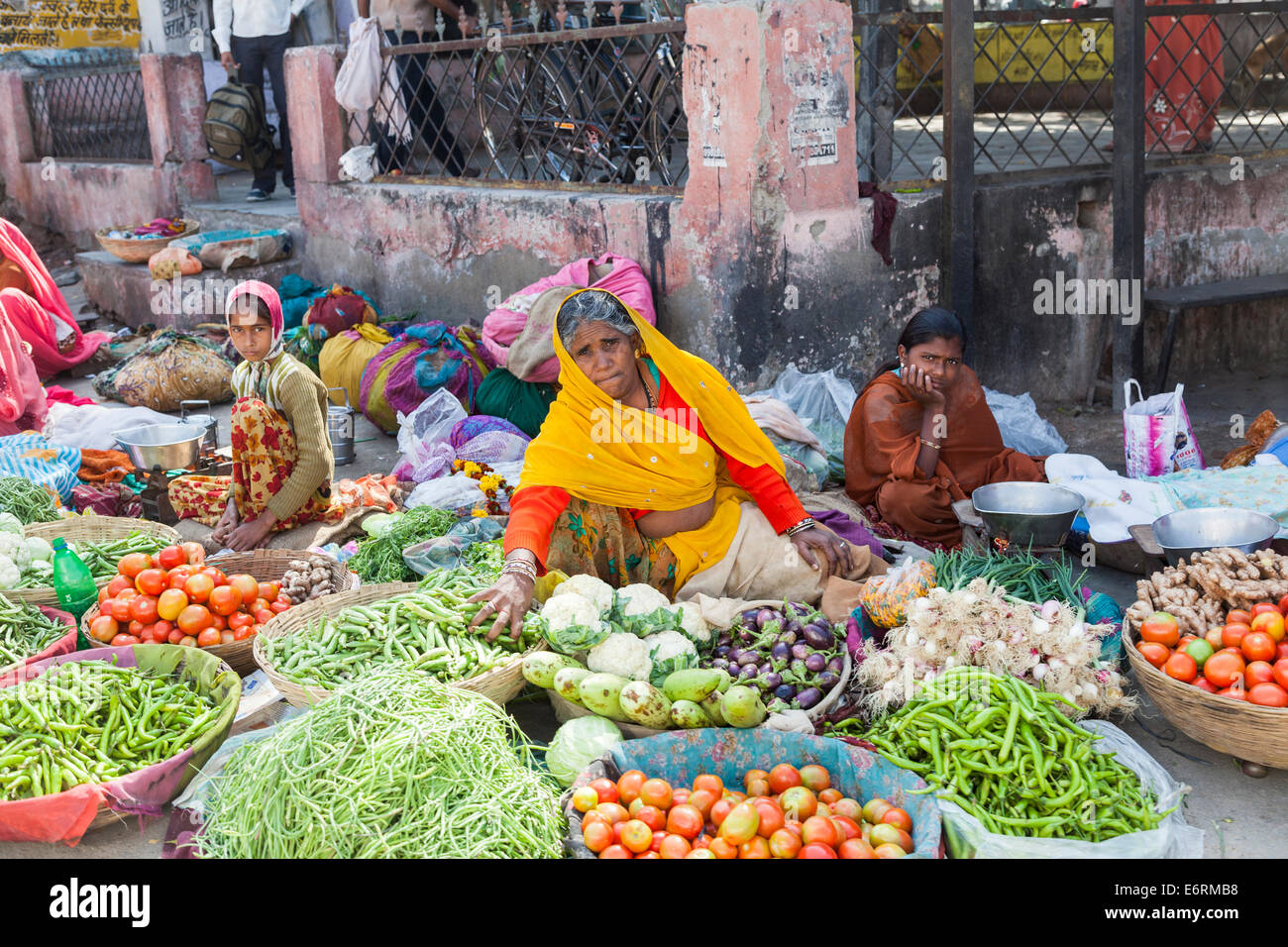 Old local Indian woman dressed in colourful traditional clothes selling ...