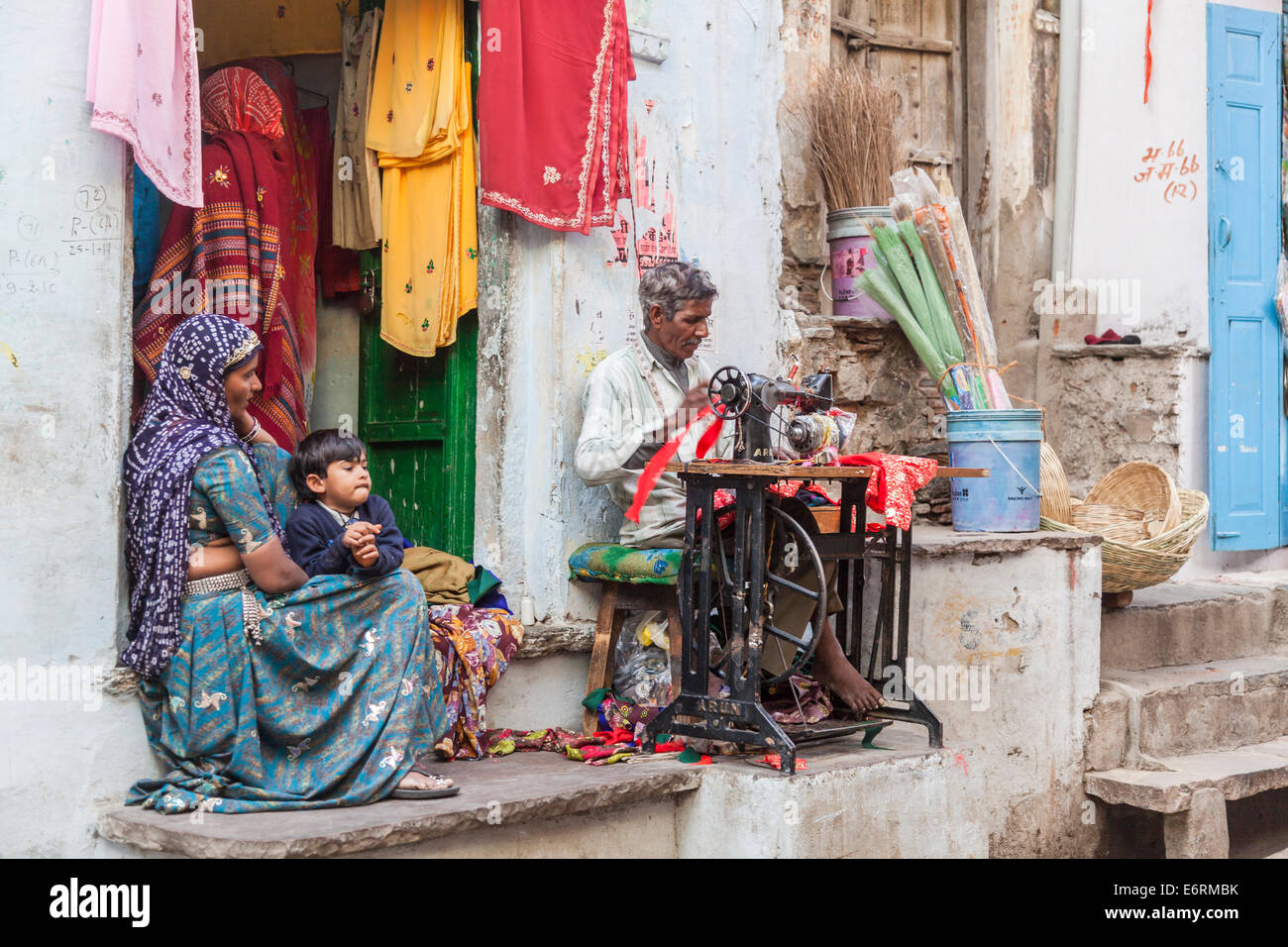 Local Indian man at work sewing on an old fashioned sewing machine on ...