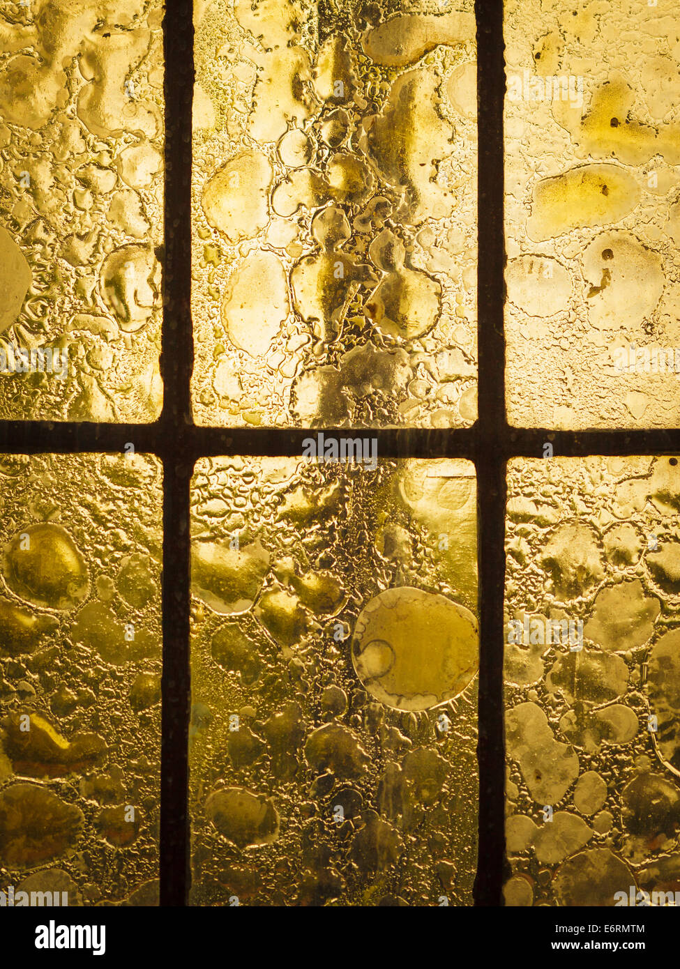 stained glass window with regular block pattern in hue of gold Stock ...