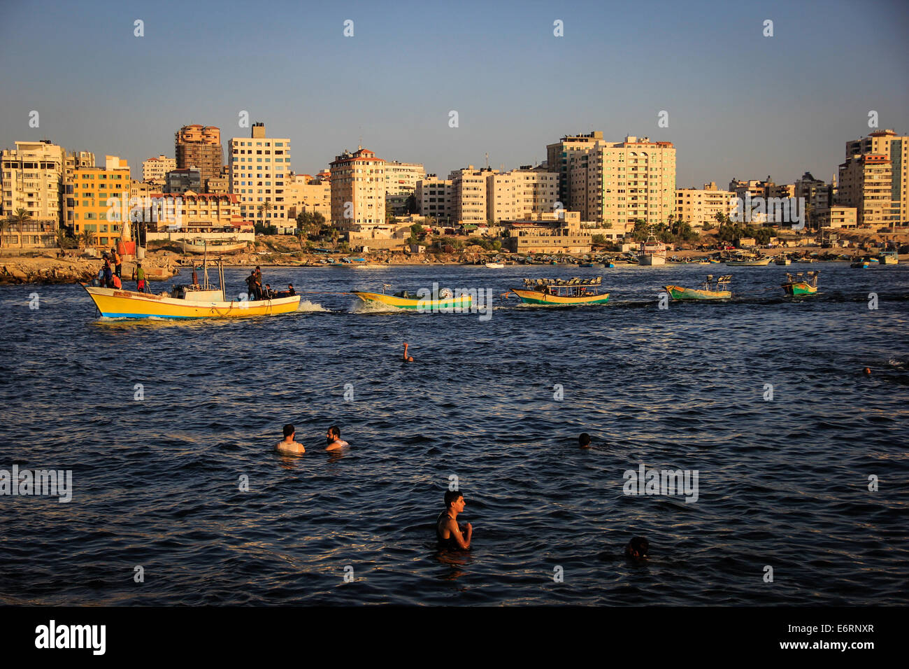 Palestinians gather and play in the Mediterranean Sea in Gaza City, on ...