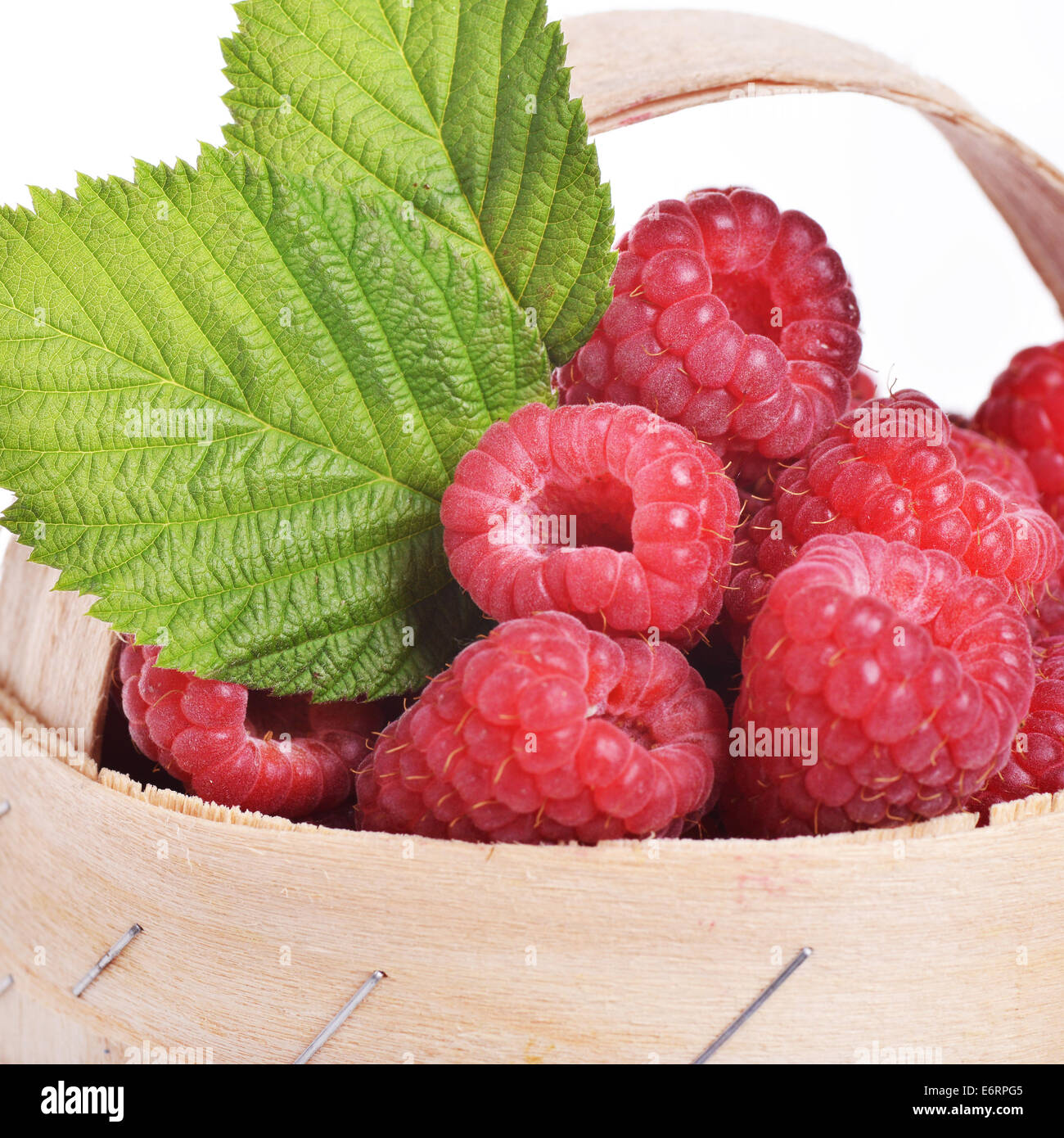 Very tasty summer raspberries in wooden basket Stock Photo - Alamy