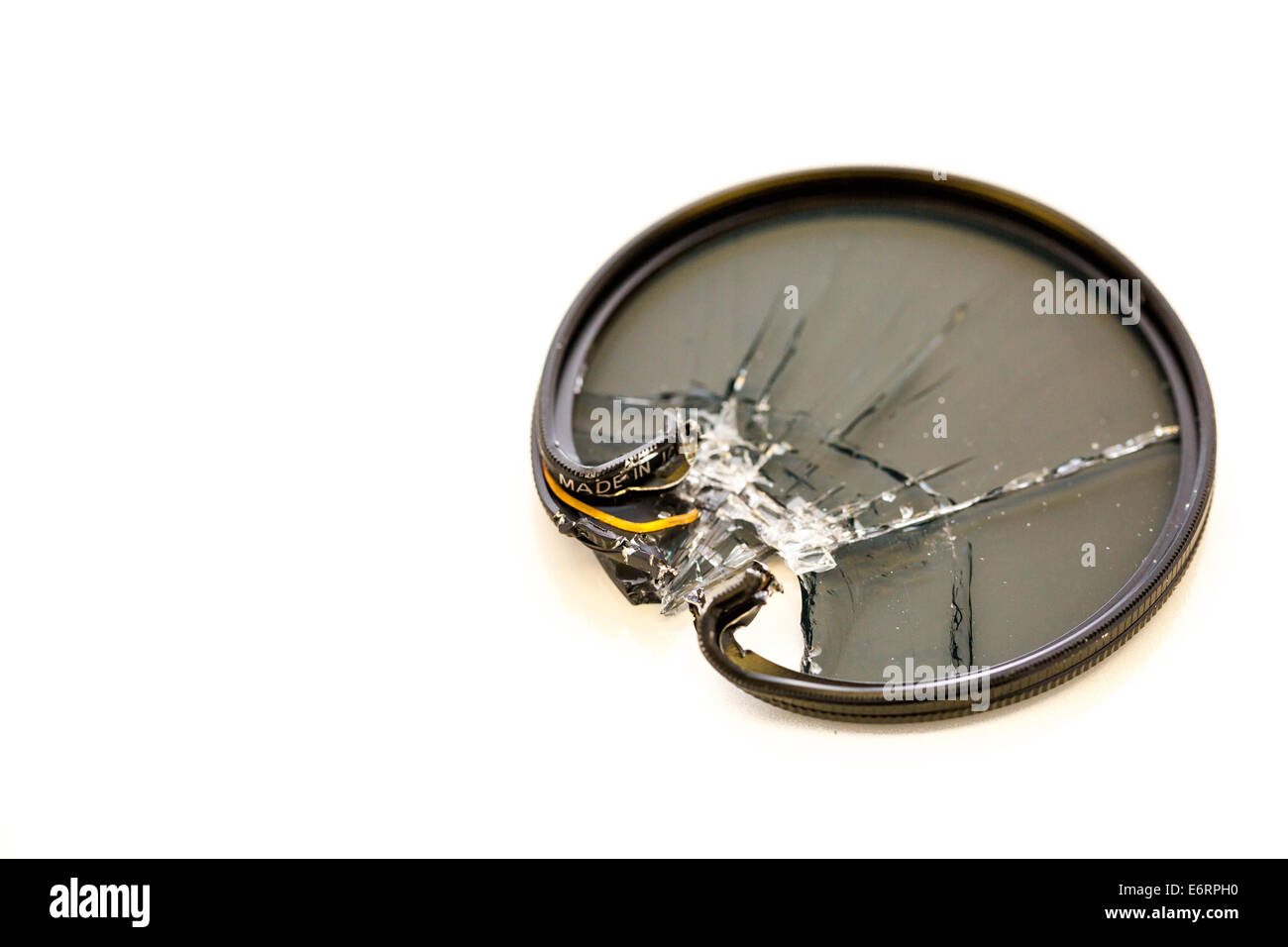 Broken polarizing filter on a white background Stock Photo - Alamy