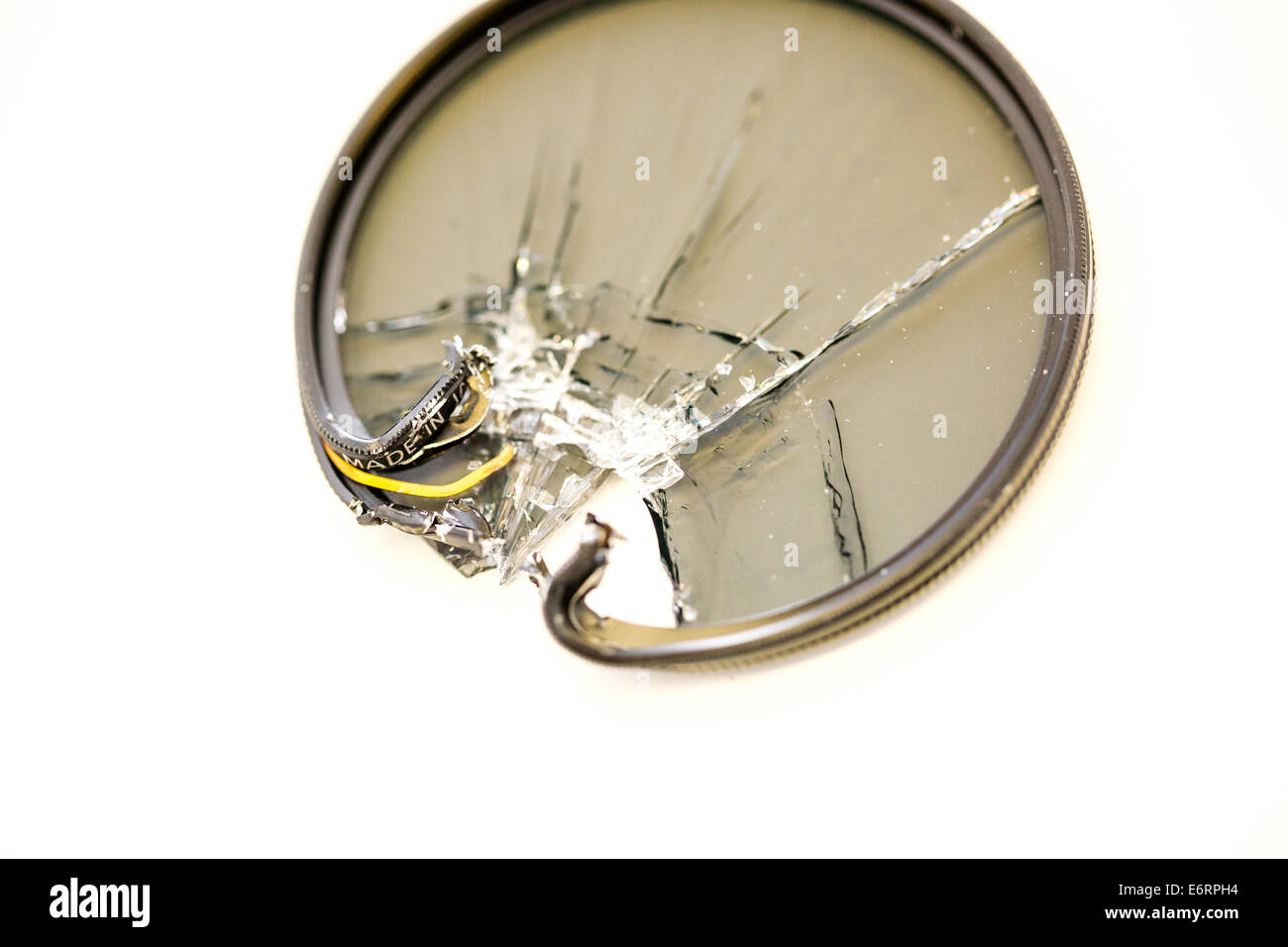 Broken polarizing filter on a white background Stock Photo - Alamy