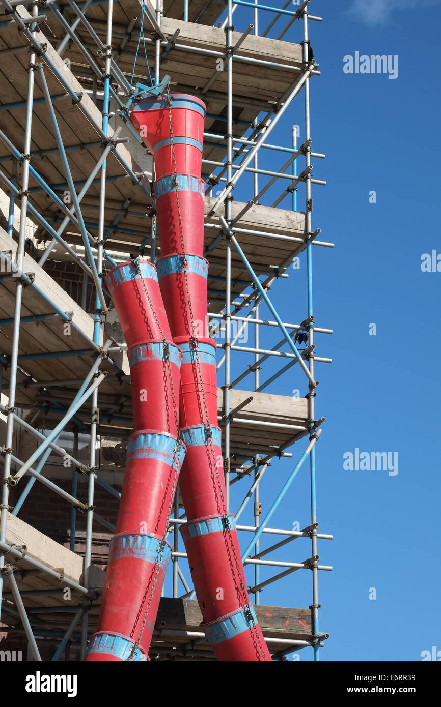 Waste material chutes on building site Stock Photo - Alamy