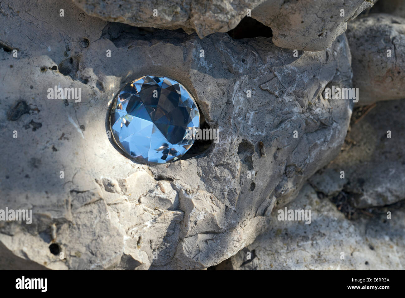diamond shaped glass on a rock Stock Photo - Alamy