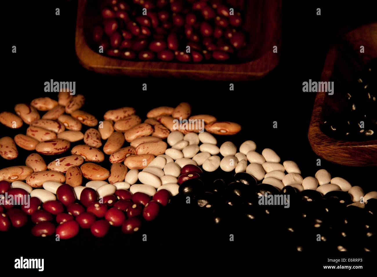 Coloured beans on black background Stock Photo - Alamy