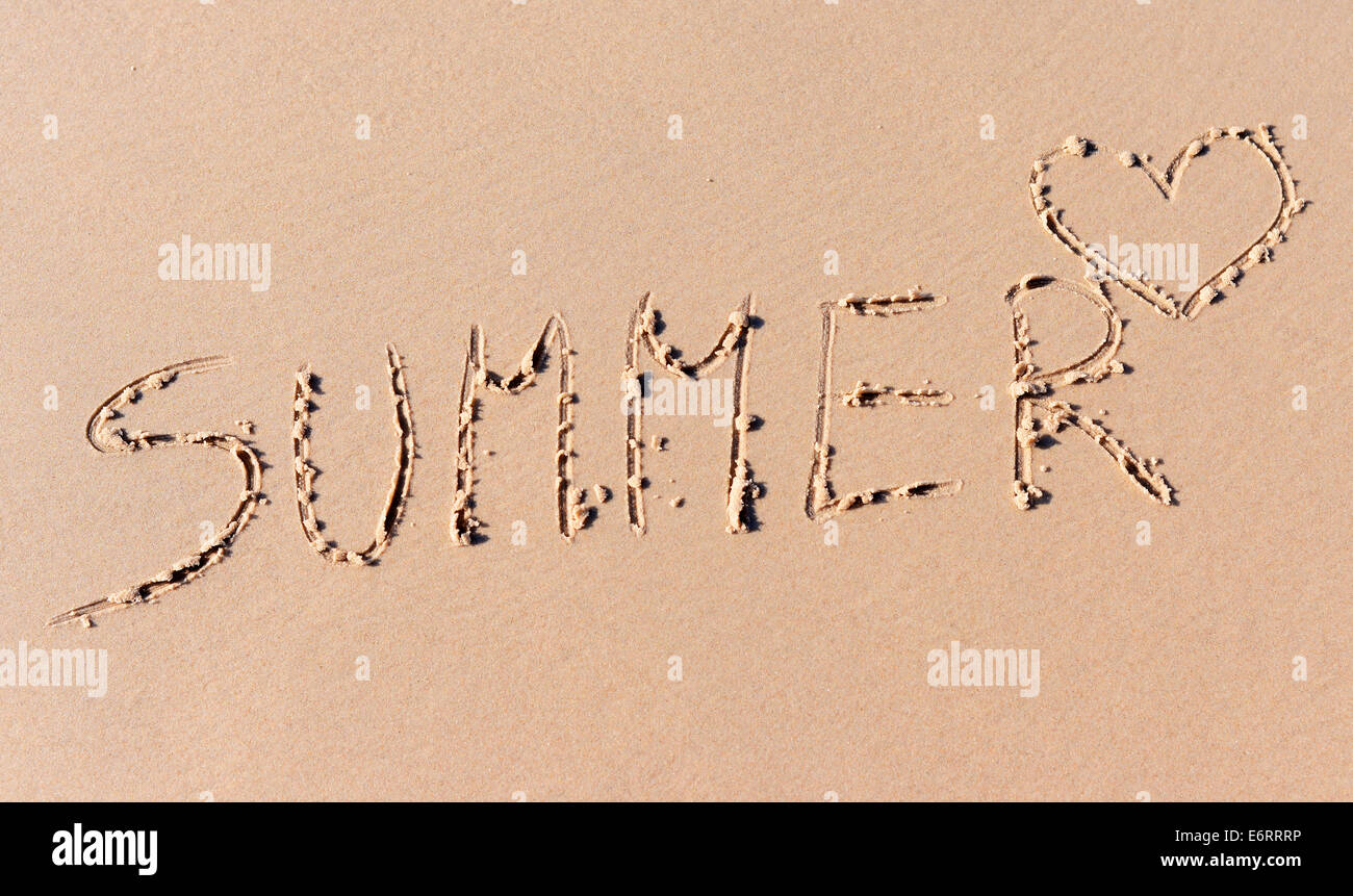 Summer word written on beach yellow sand Stock Photo - Alamy