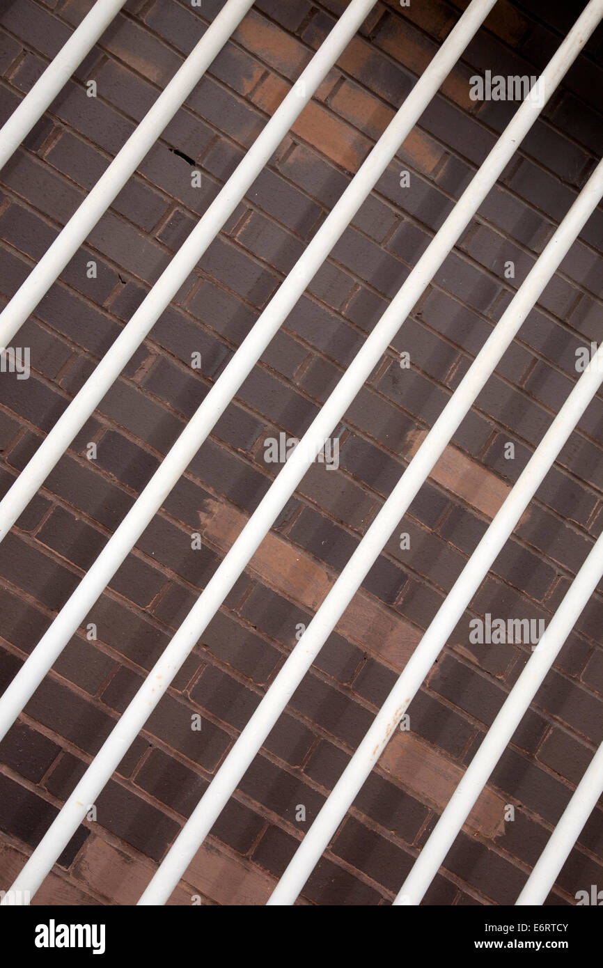 White Metal Railings on Brick Wall Background on Diagonal Tilted Angle ...