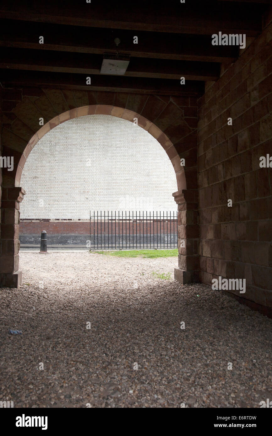 White Urban Wall through Stone Arch Stock Photo - Alamy