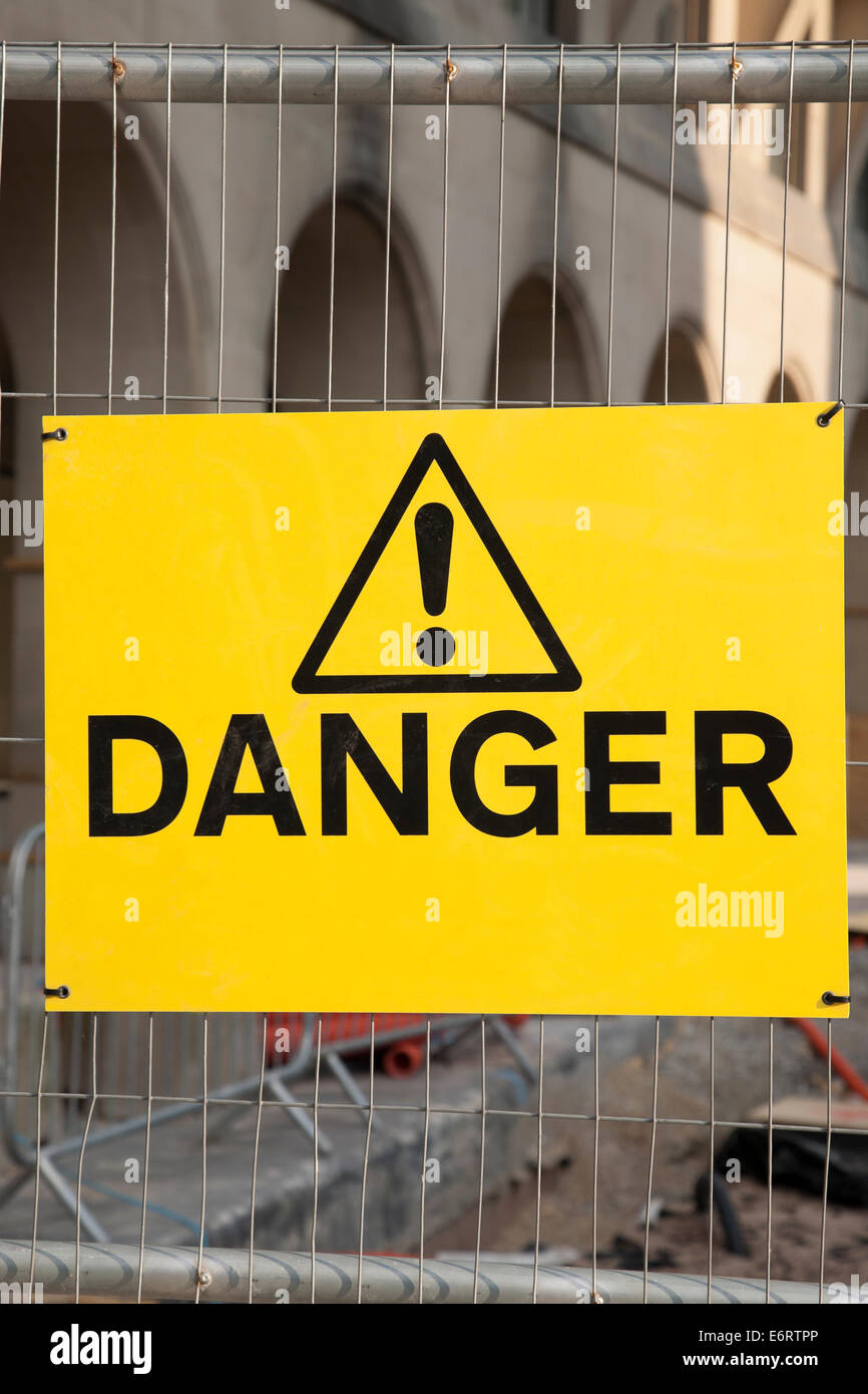 Yellow Danger Sign on Construction Site Stock Photo - Alamy