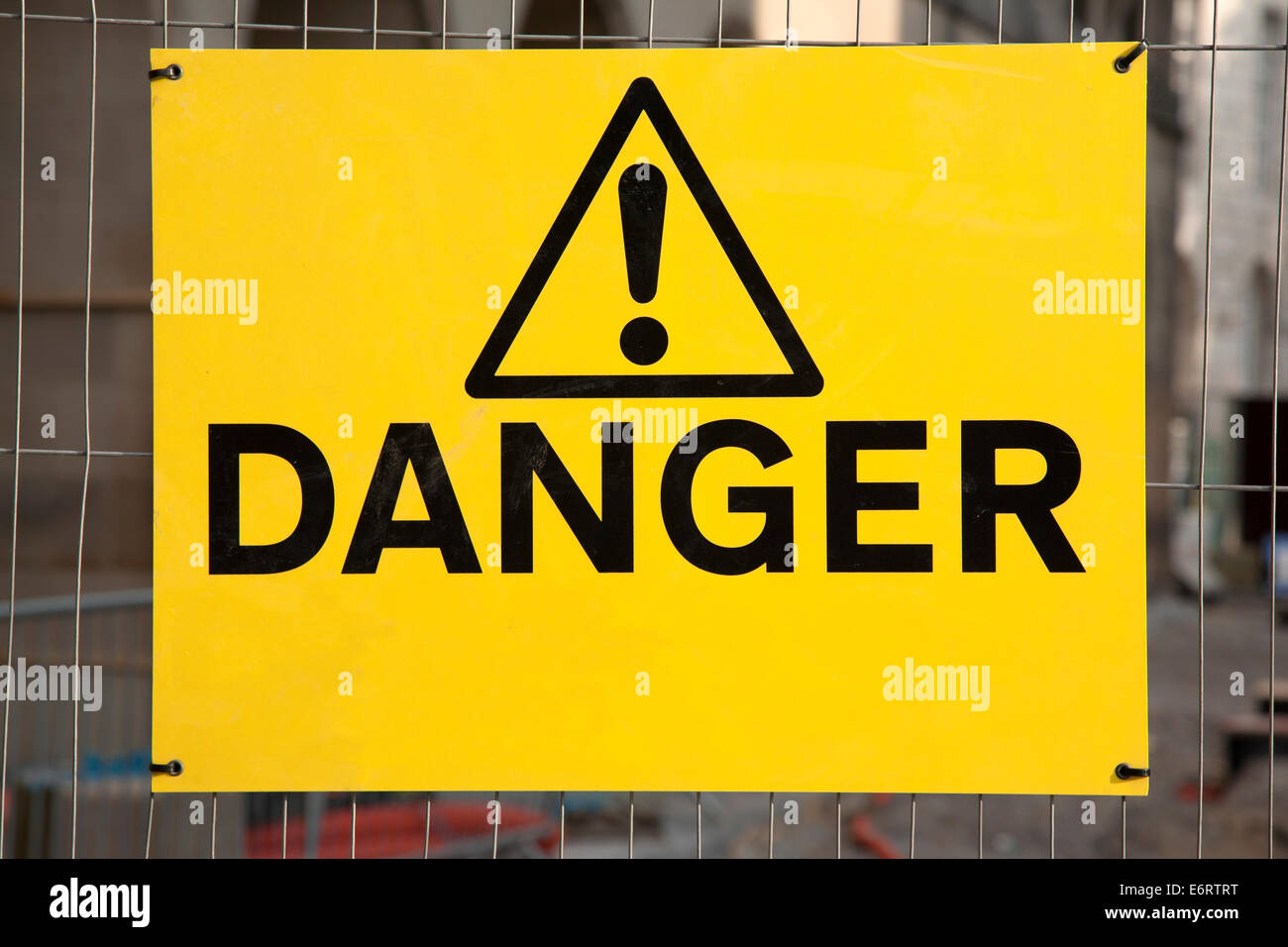 Yellow Danger Sign on Construction Site Stock Photo - Alamy
