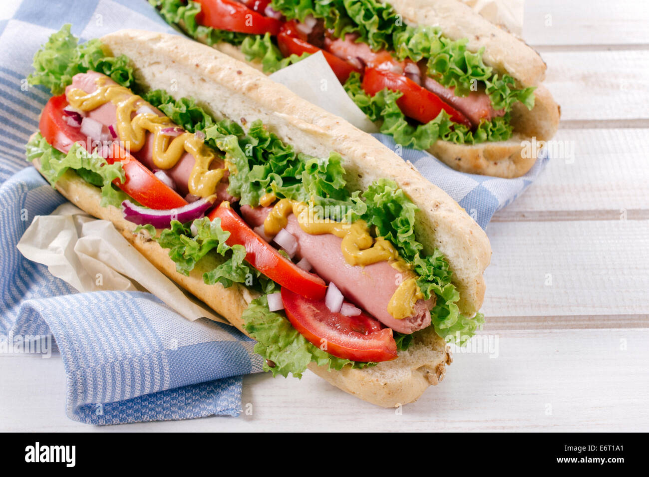 Traditional German boiled wurst in buns.Selective focus on the front ...