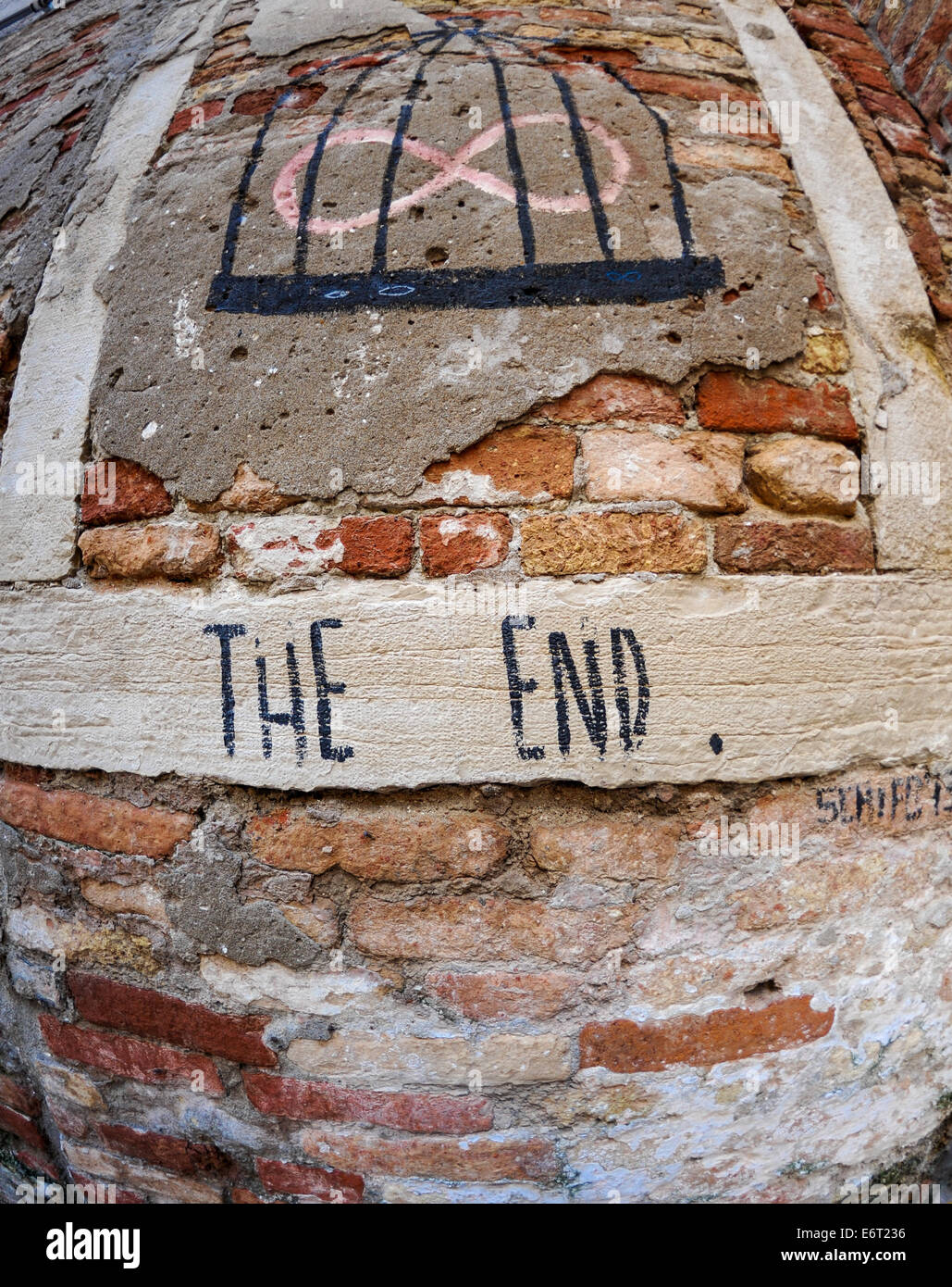 The end painted onto a brick wall with the infinity sign in a cage ...