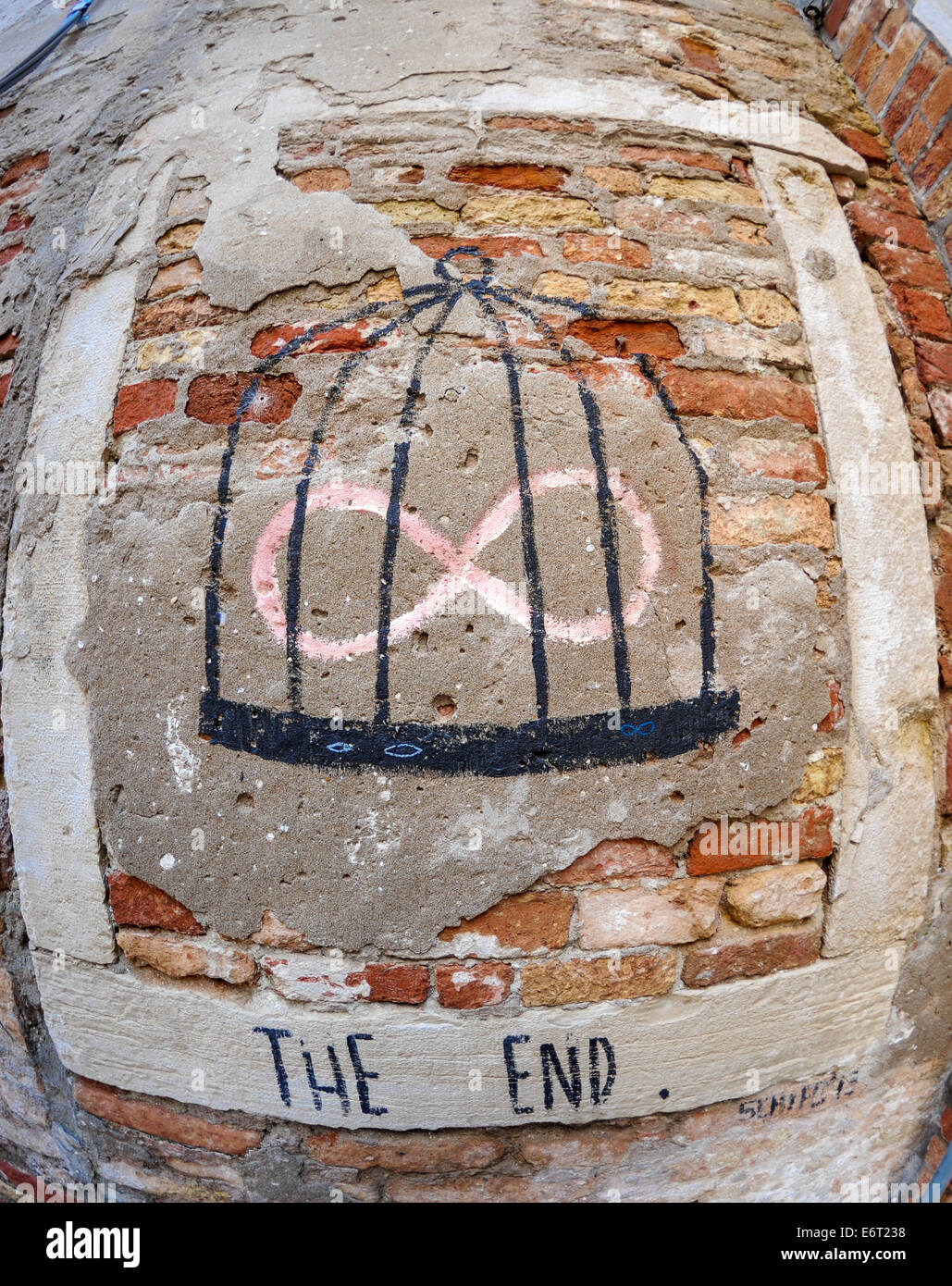 The end painted onto a brick wall with the infinity sign in a cage ...