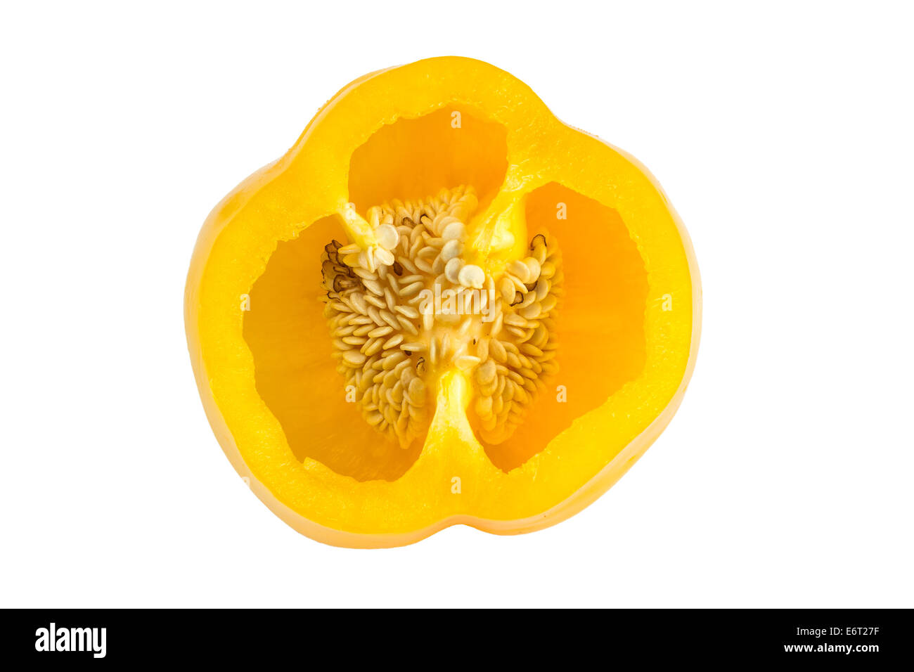 Closeup of a ripe yellow bell pepper cut in half, isolated on white ...