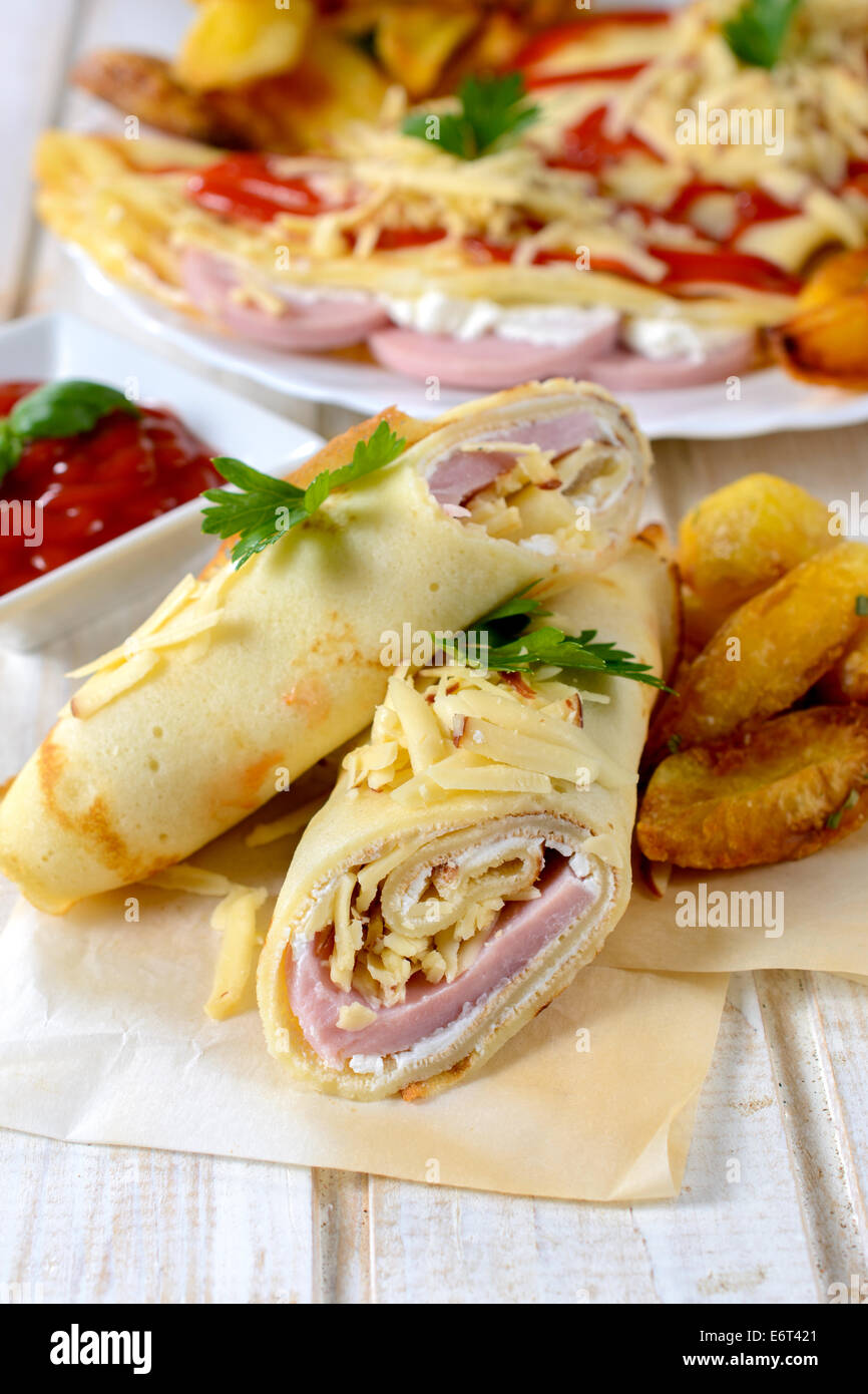 Tasty flapjacks stuffed with cheese and ham.Selective focus on the ...