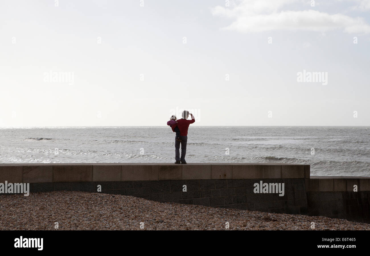 Man looking out to sea Stock Photo - Alamy