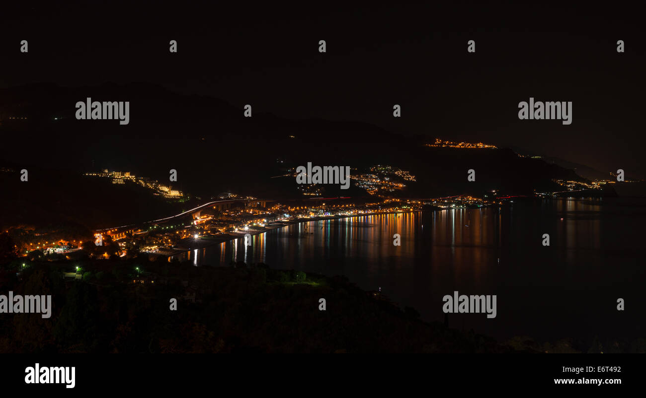 View of sicilian coast form Taormina town at night Stock Photo - Alamy