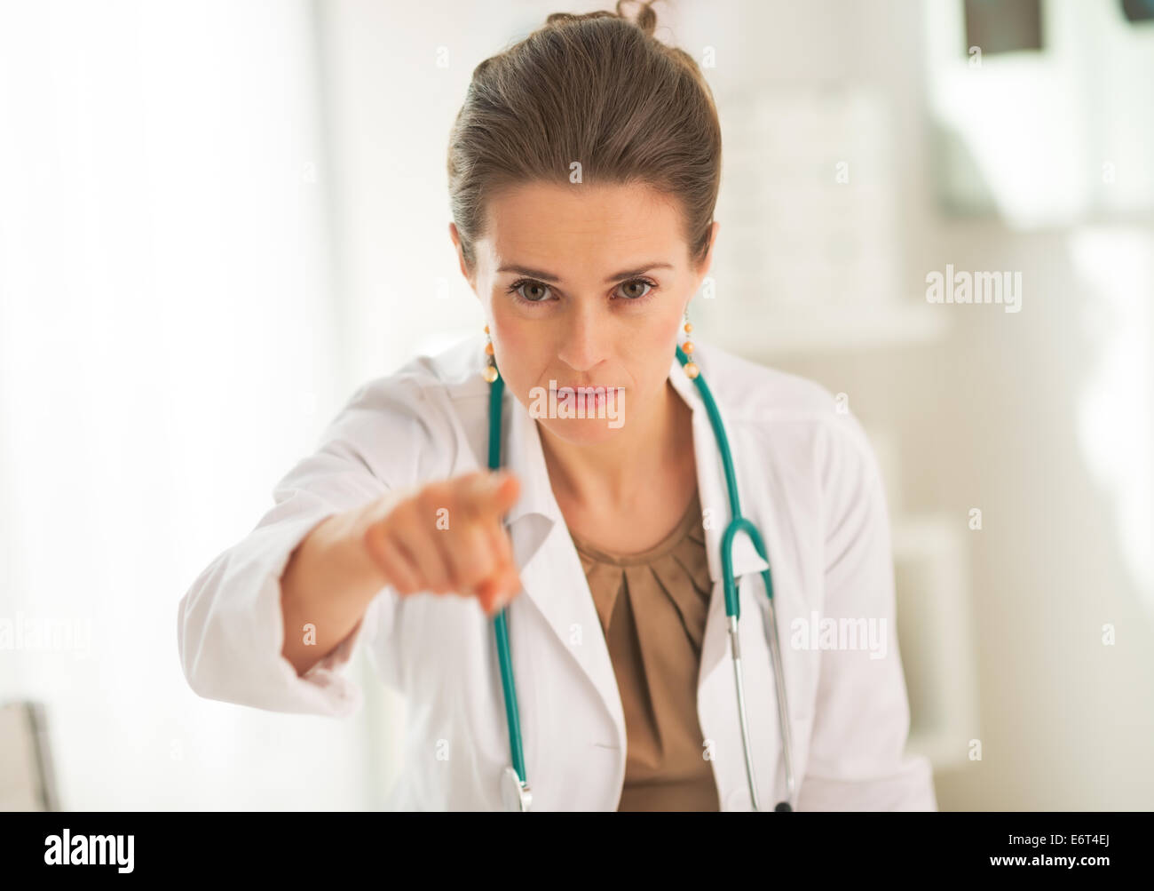 Doctor woman pointing in camera Stock Photo - Alamy