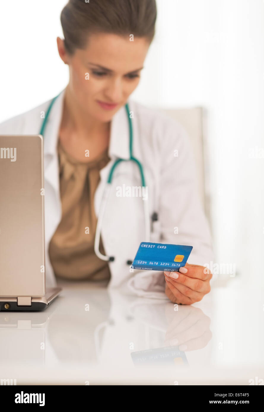 Closeup on doctor woman using credit card Stock Photo - Alamy