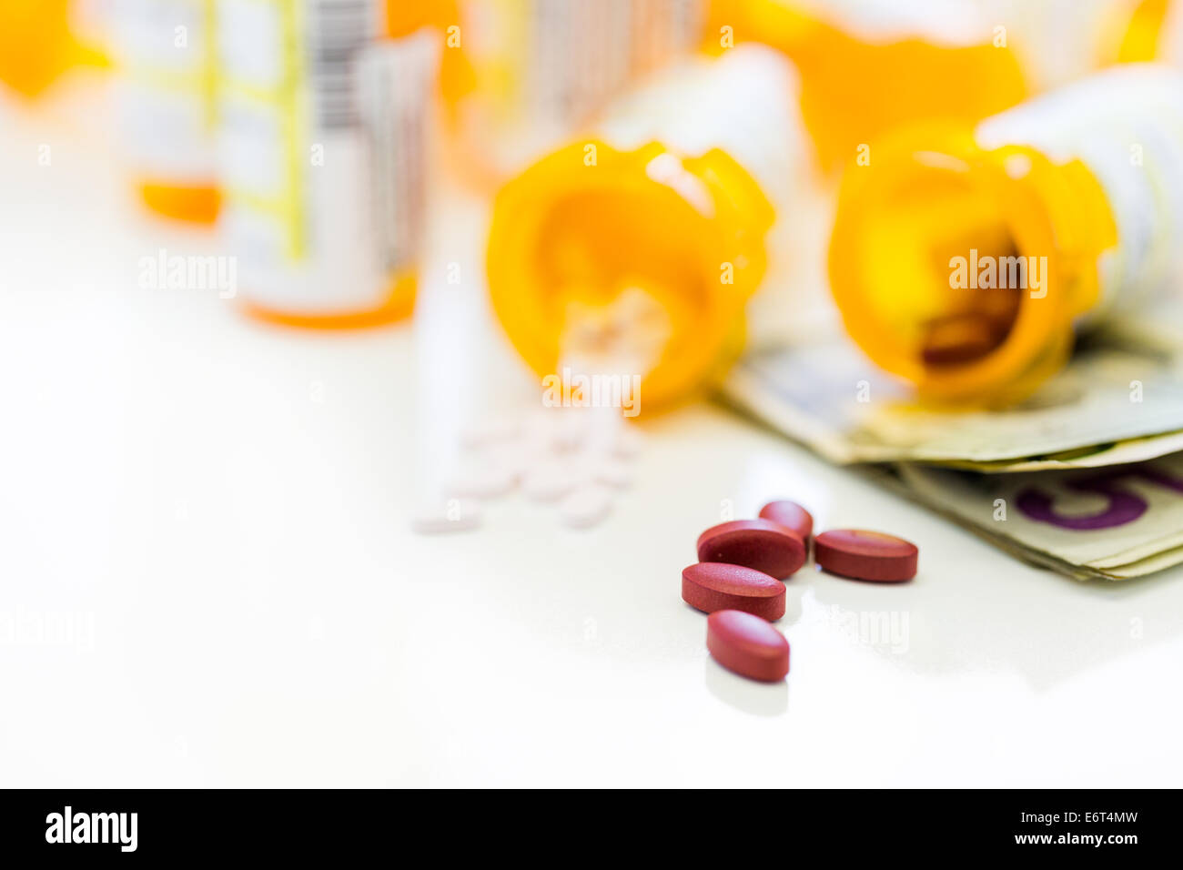 Prescription pills in yellow bottles on a white background Stock Photo ...