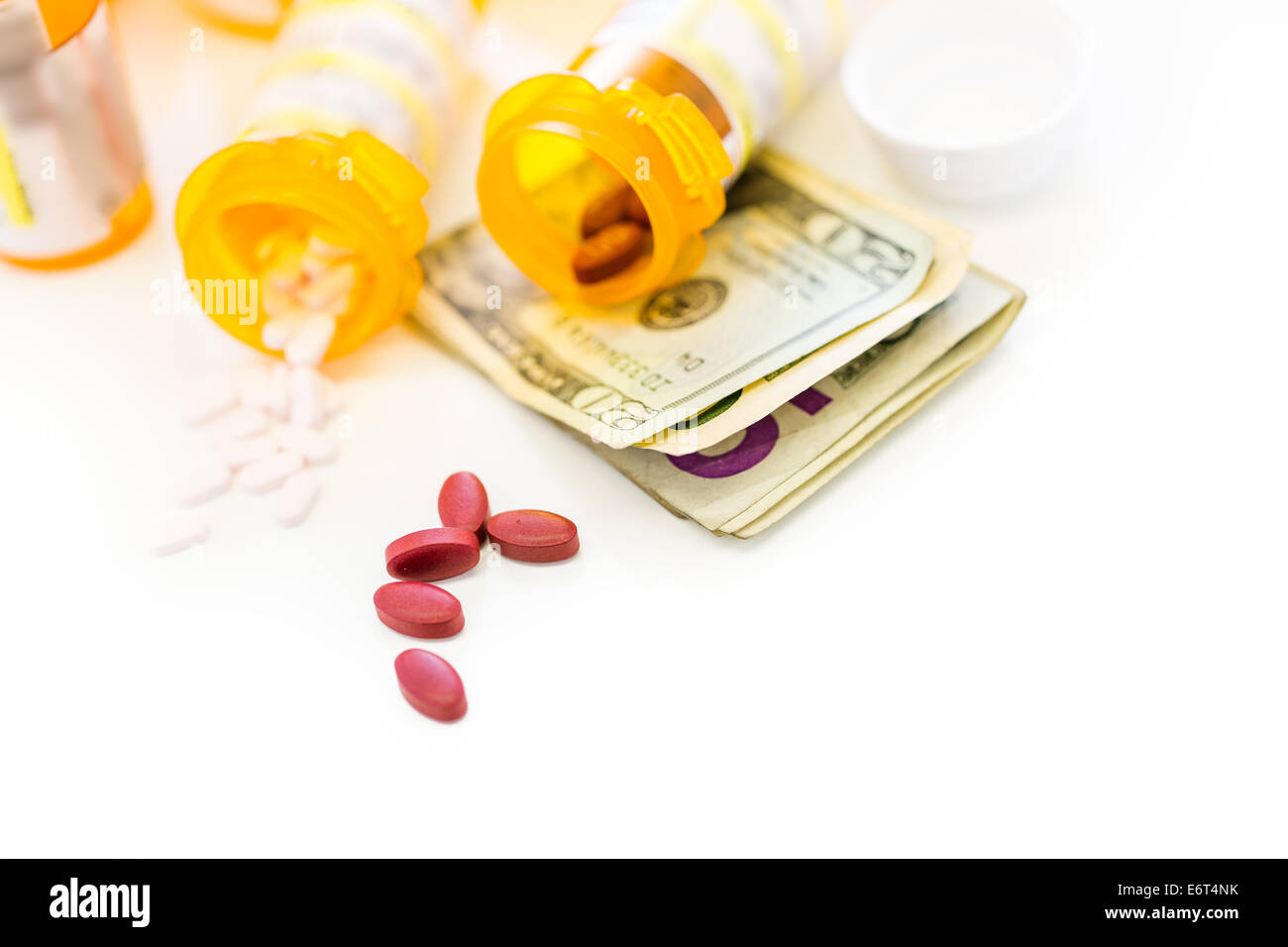 Prescription pills in yellow bottles on a white background Stock Photo ...