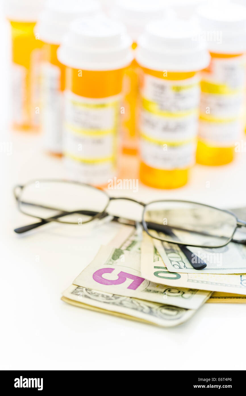 Prescription pills in yellow bottles on a white background Stock Photo ...