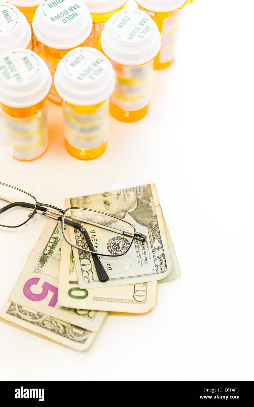 Prescription pills in yellow bottles on a white background Stock Photo ...