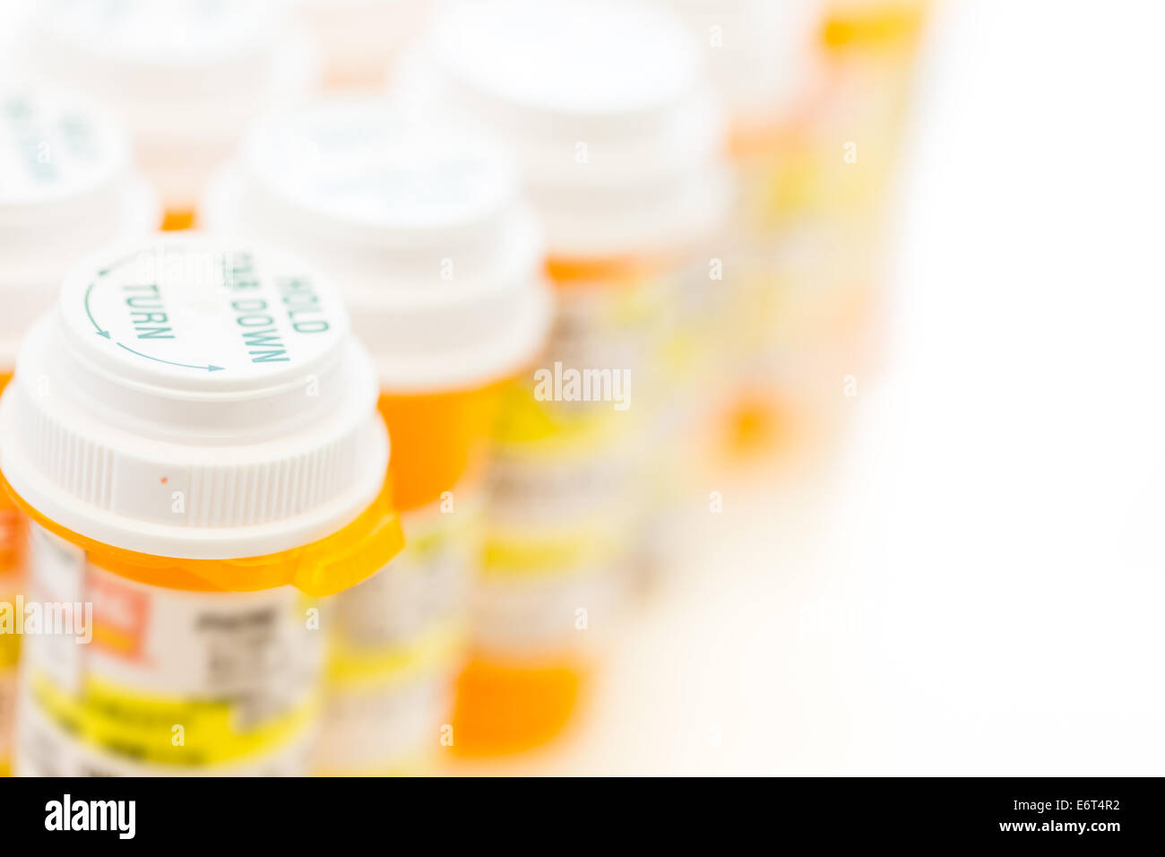 Prescription pills in yellow bottles on a white background Stock Photo ...