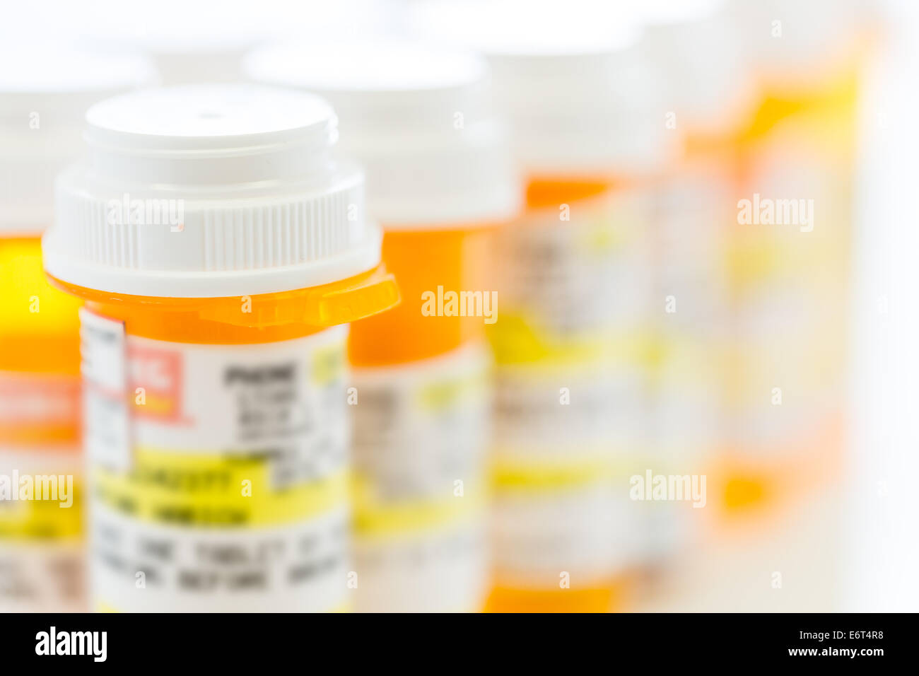 Prescription pills in yellow bottles on a white background Stock Photo ...