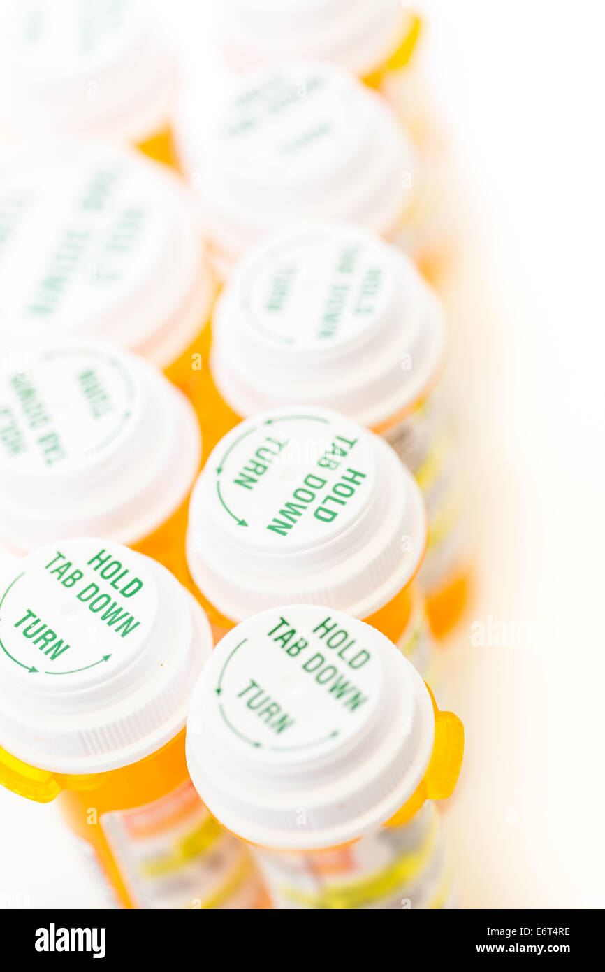 Prescription pills in yellow bottles on a white background Stock Photo ...