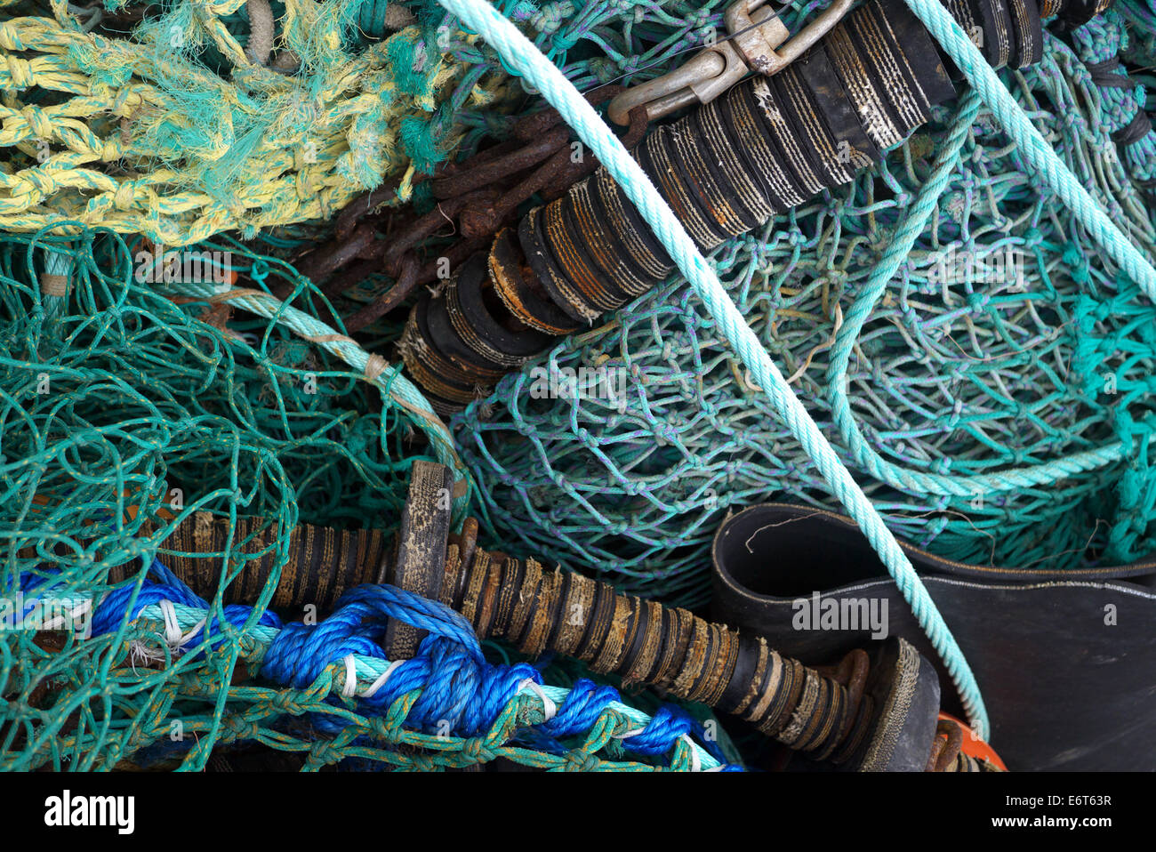 Fishing boat still life, showing nets, buoys and various trawler and ...