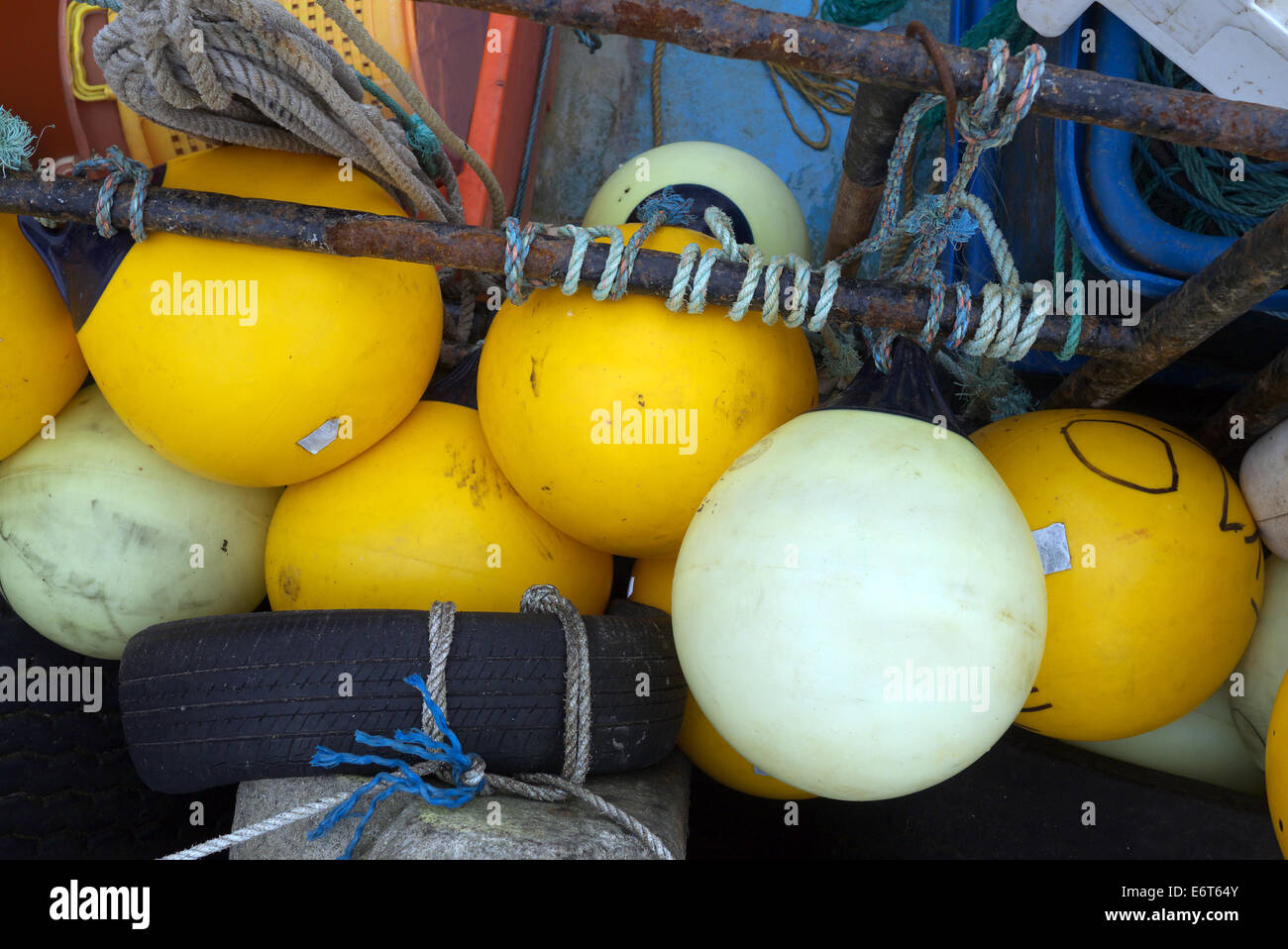 Fishing boat still life, showing nets, buoys and various trawler and ...