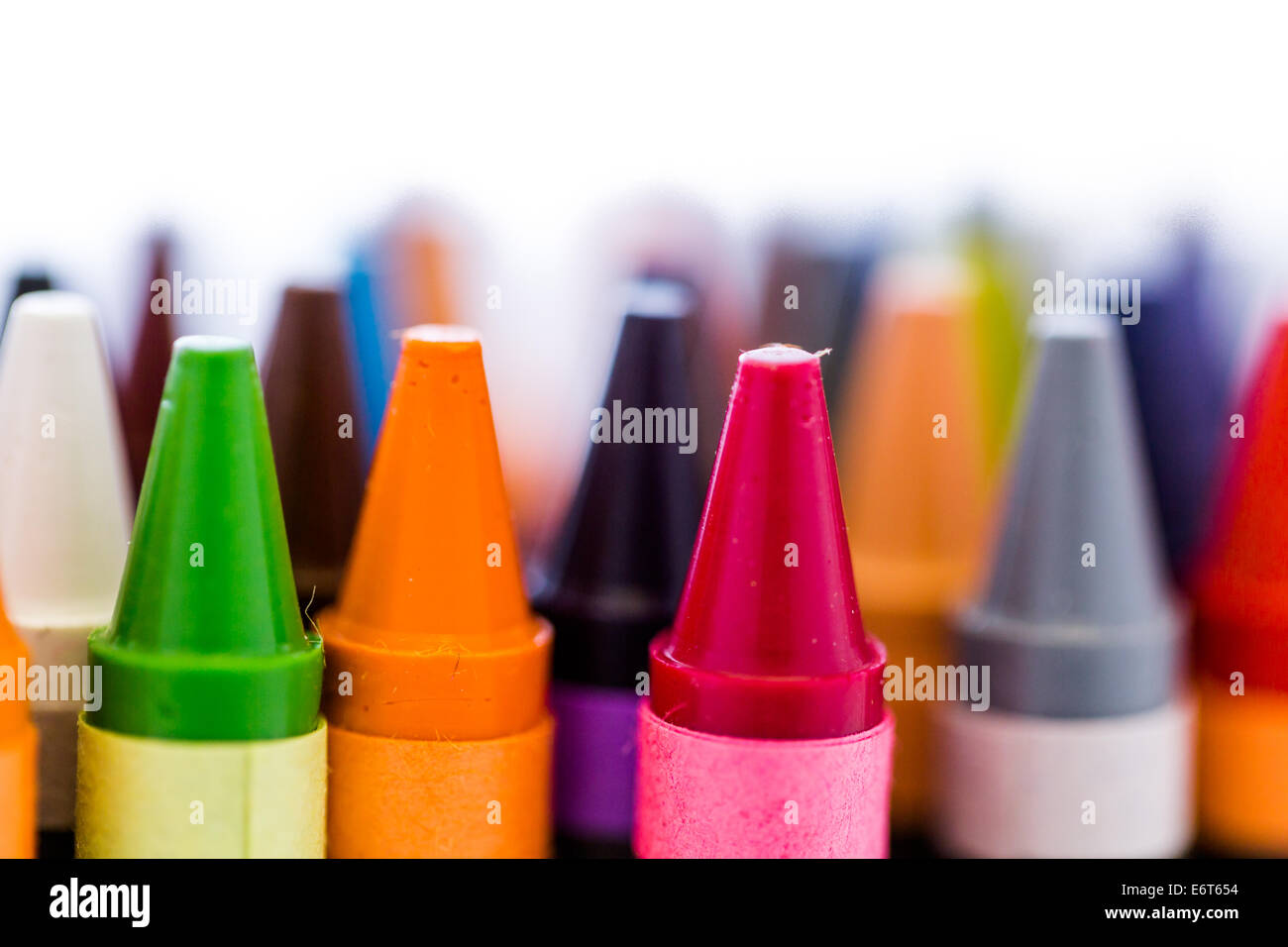 Multicolored crayons on a white background Stock Photo - Alamy