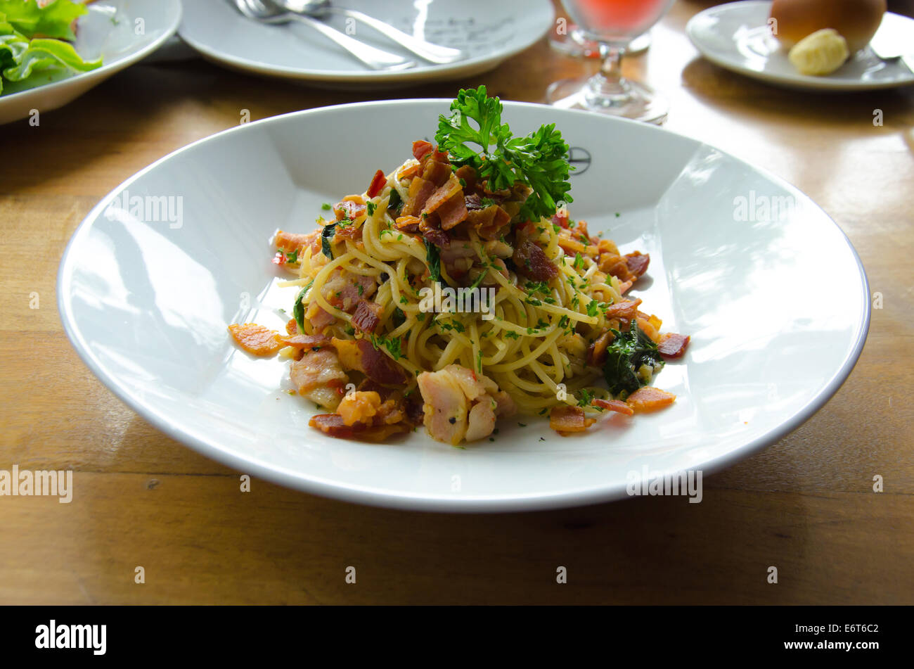 spicy spaghetti with ham for meal Stock Photo - Alamy