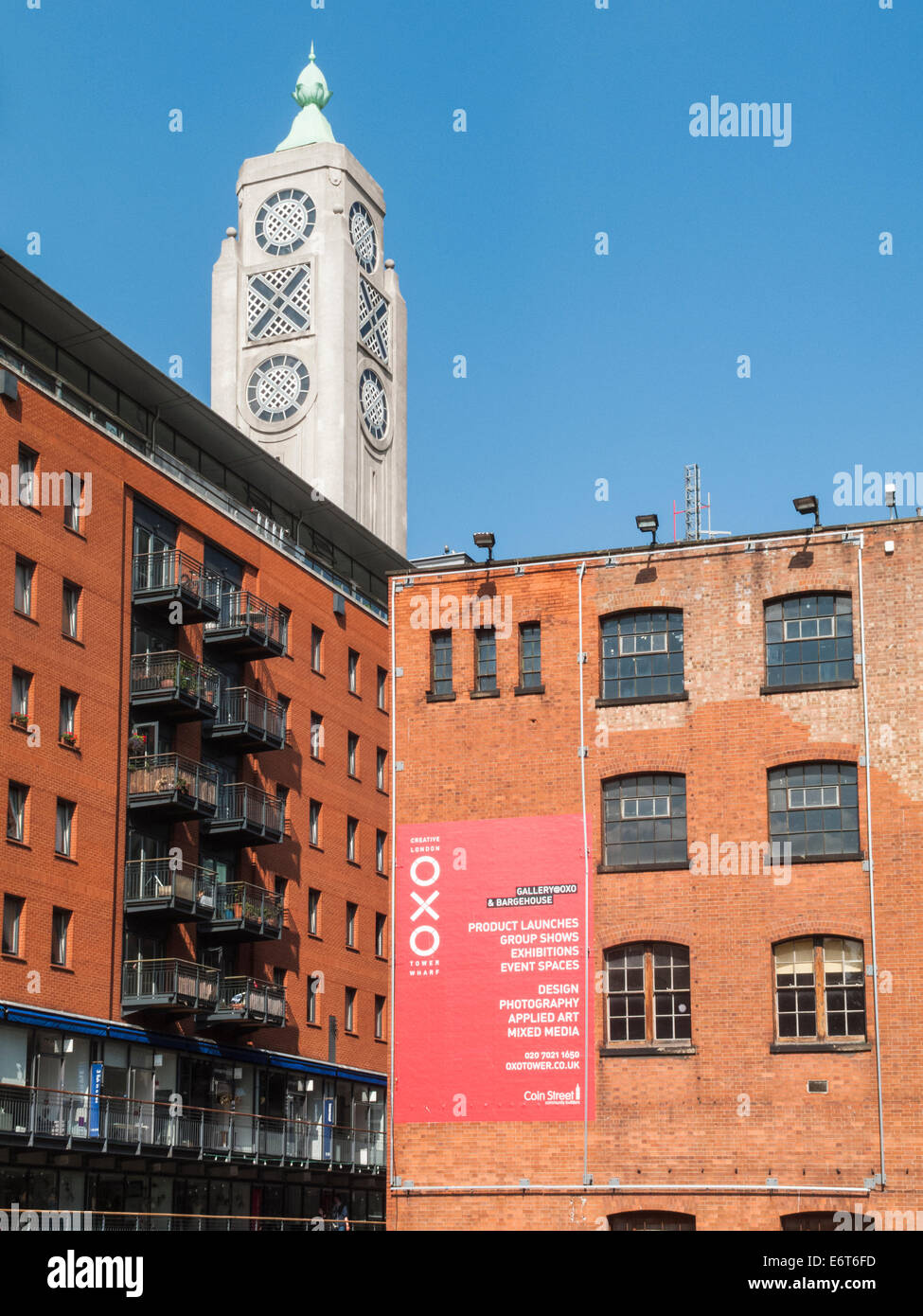 Red advertisement painted on a wall at the Oxo Tower, Southwark, London ...