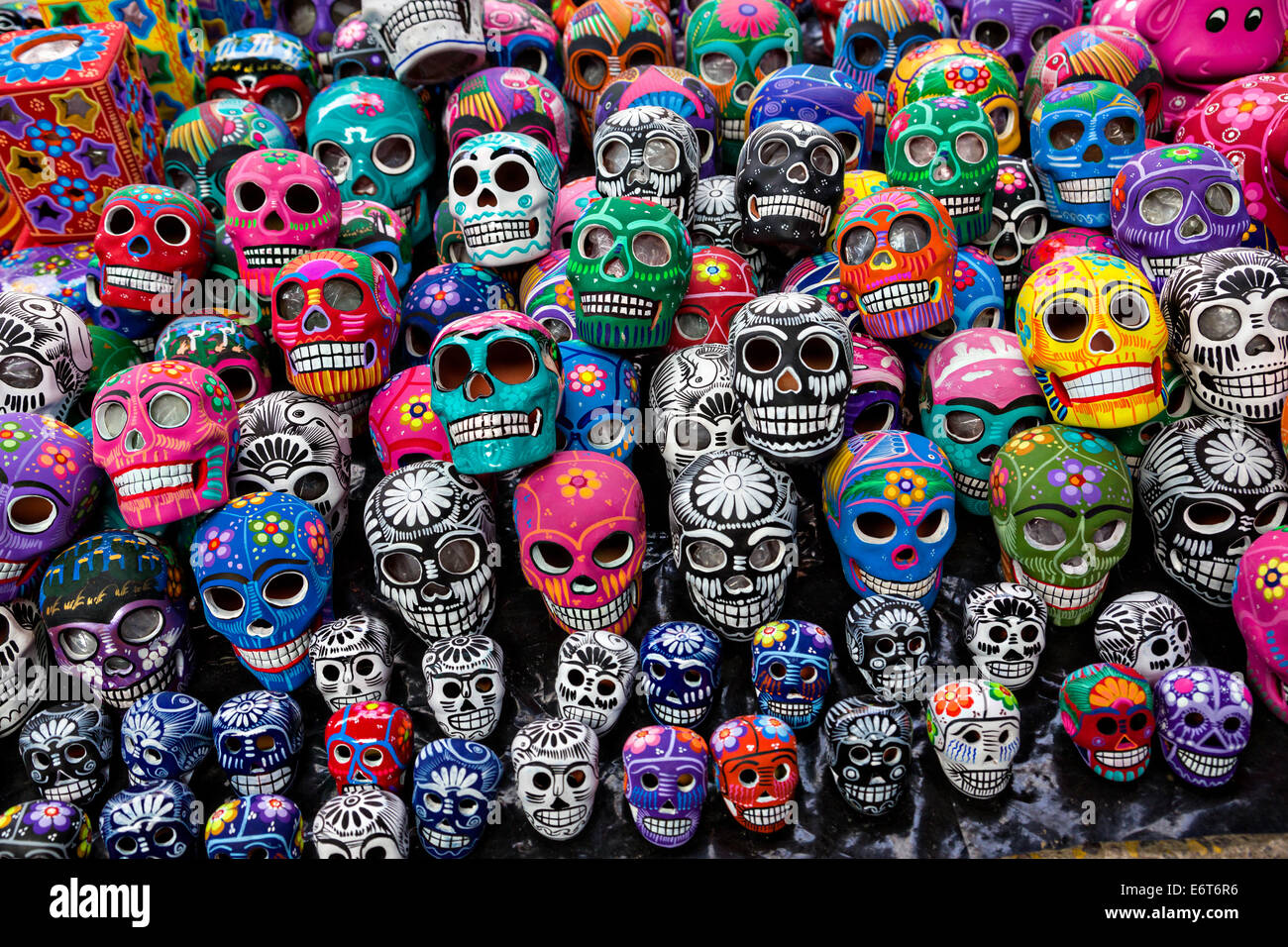 A vendor displays colorful painted skulls for the Day of the Dead ...