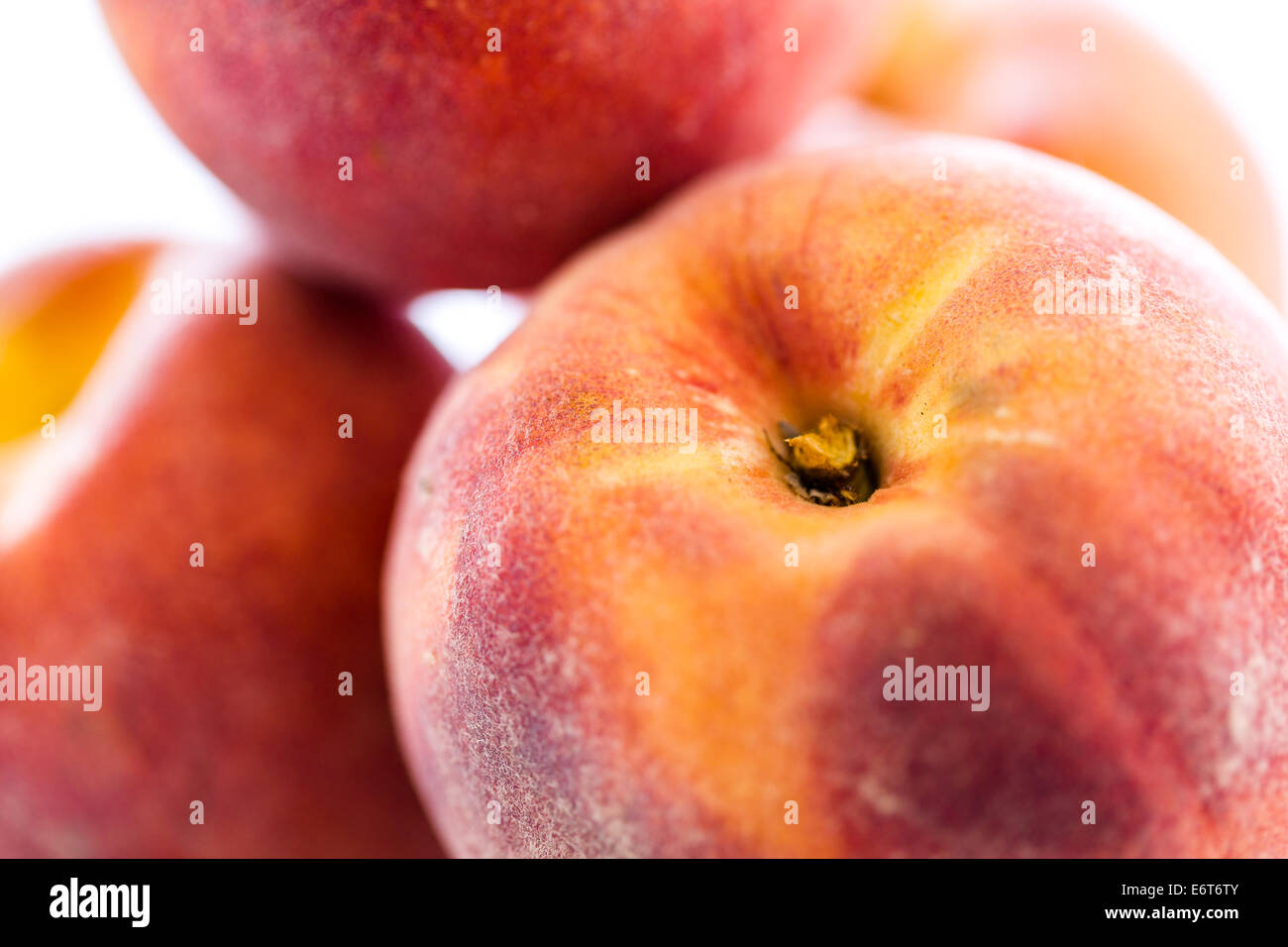 Organic peaches on a white background Stock Photo - Alamy