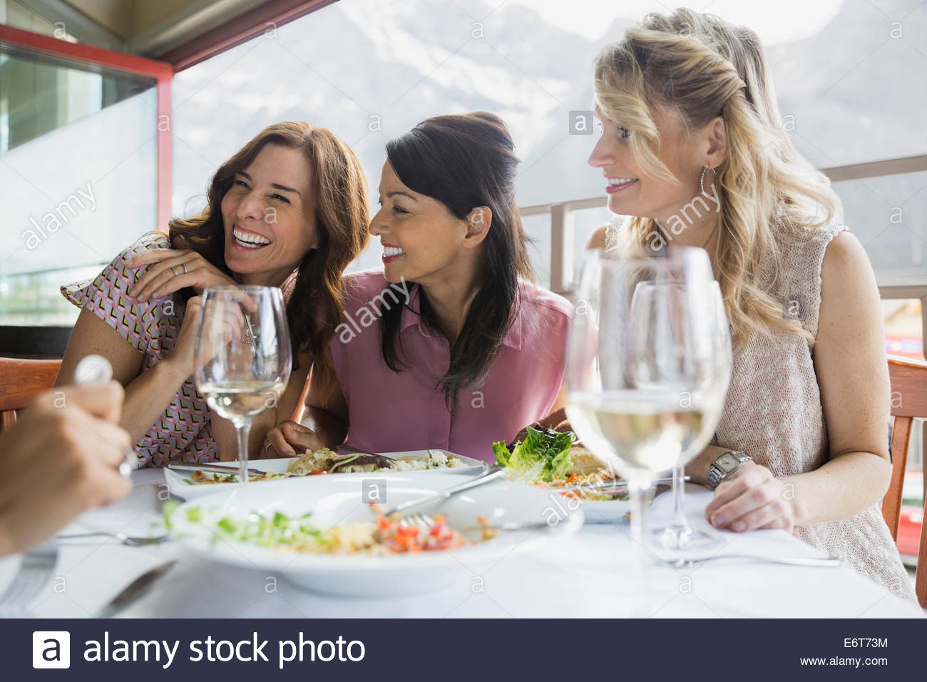 Women eating together in restaurant Stock Photo - Alamy