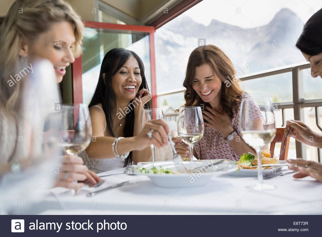 Women eating together in restaurant Stock Photo - Alamy
