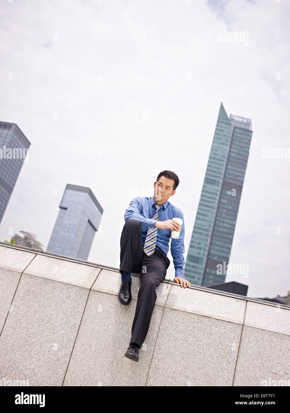 Man sitting on rooftop hi-res stock photography and images - Alamy