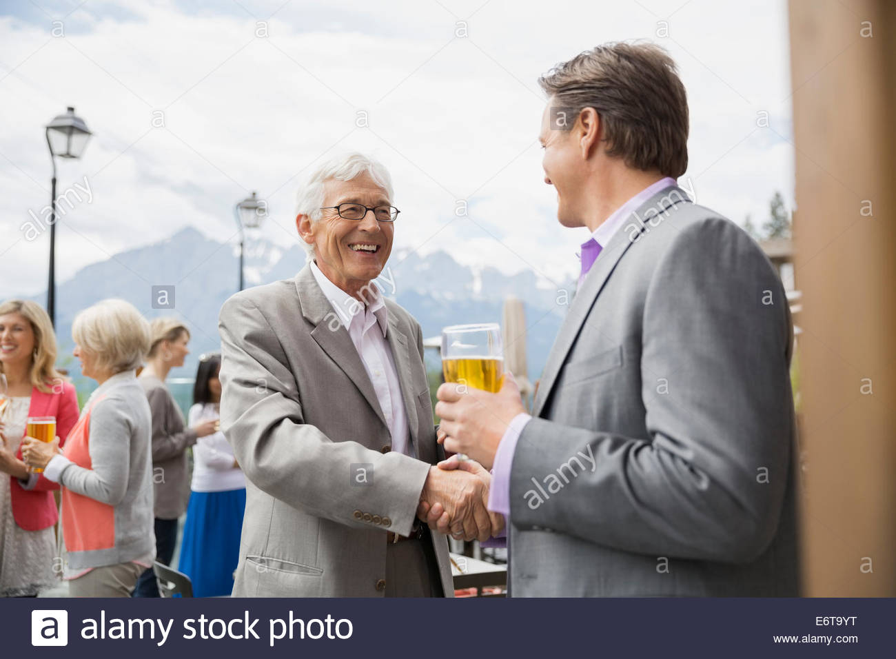 People shaking hands party hi-res stock photography and images - Alamy