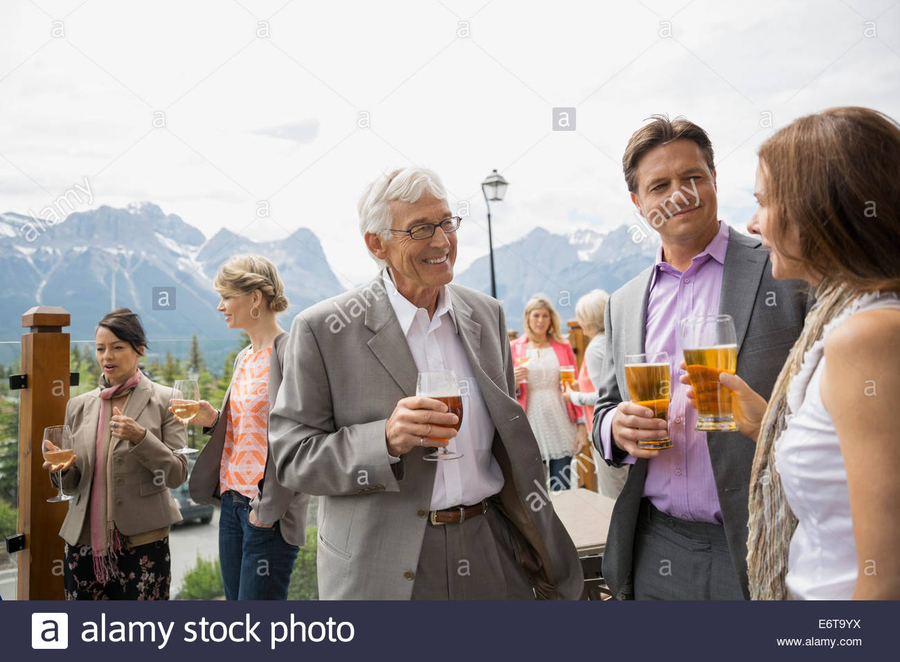 Business people talking at networking event Stock Photo - Alamy